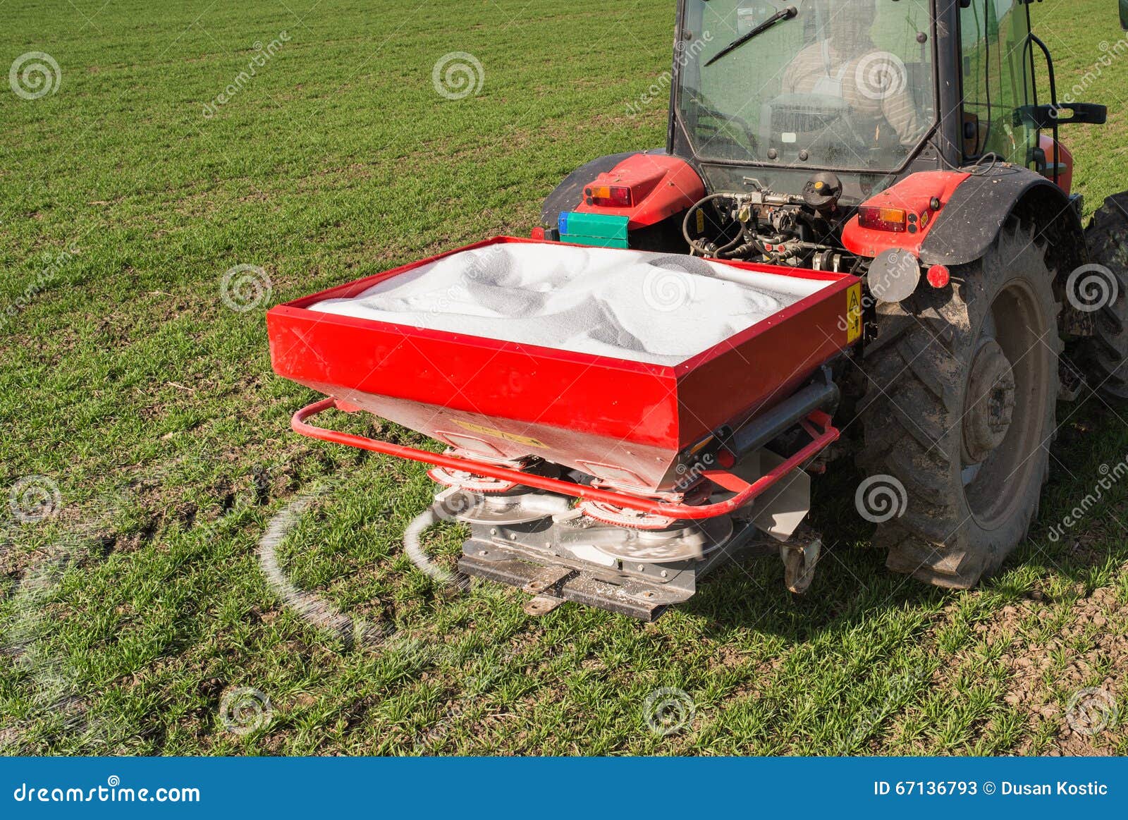 Tractor Fertilizing in Field Stock Image - Image of horizontal, grass ...