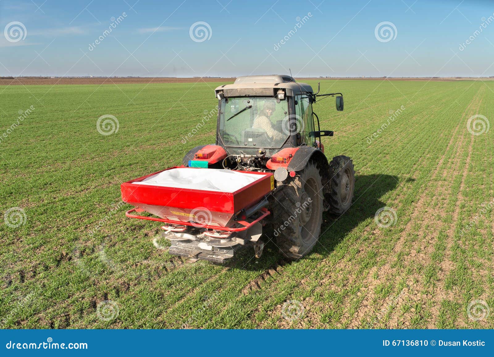 Tractor Fertilizing in Field Stock Photo - Image of horizontal ...
