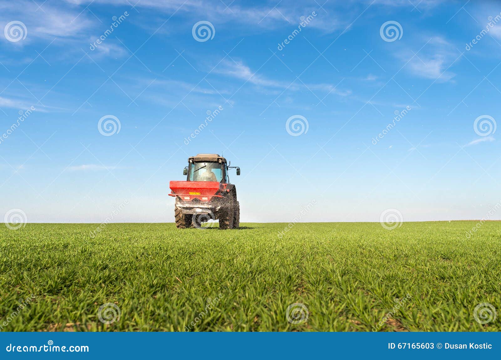 Tractor Fertilizing in Field Stock Image - Image of tractor, driving ...