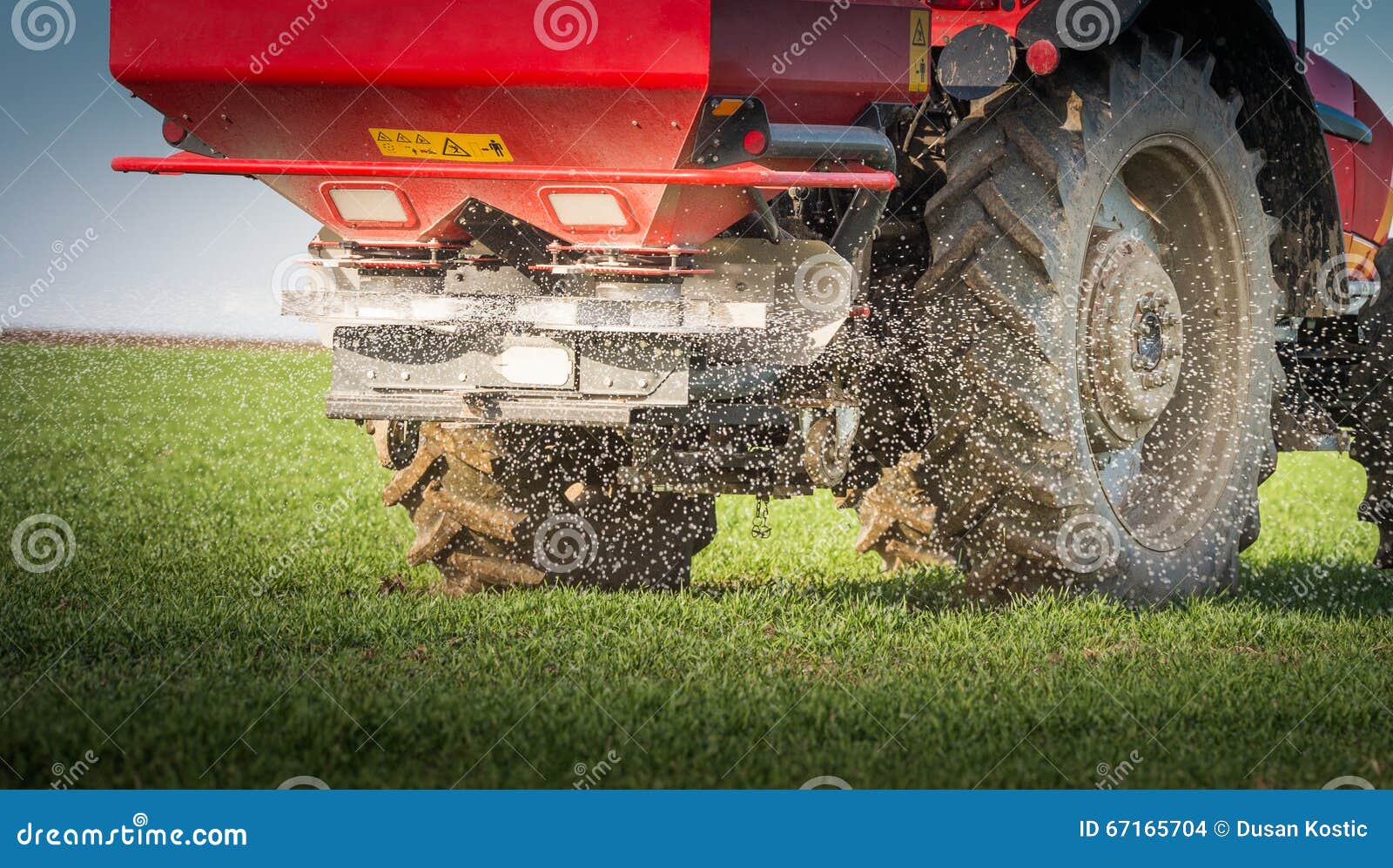Tractor Fertilizing in Field Stock Photo - Image of countryside ...