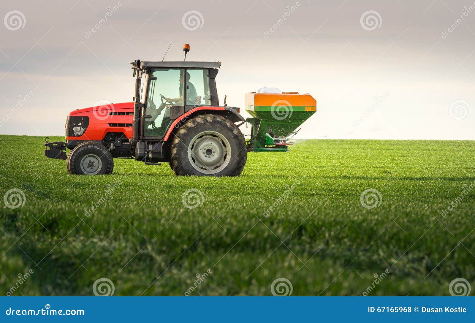 Tractor Fertilizing in Field Stock Photo - Image of tractor, fertilizer ...