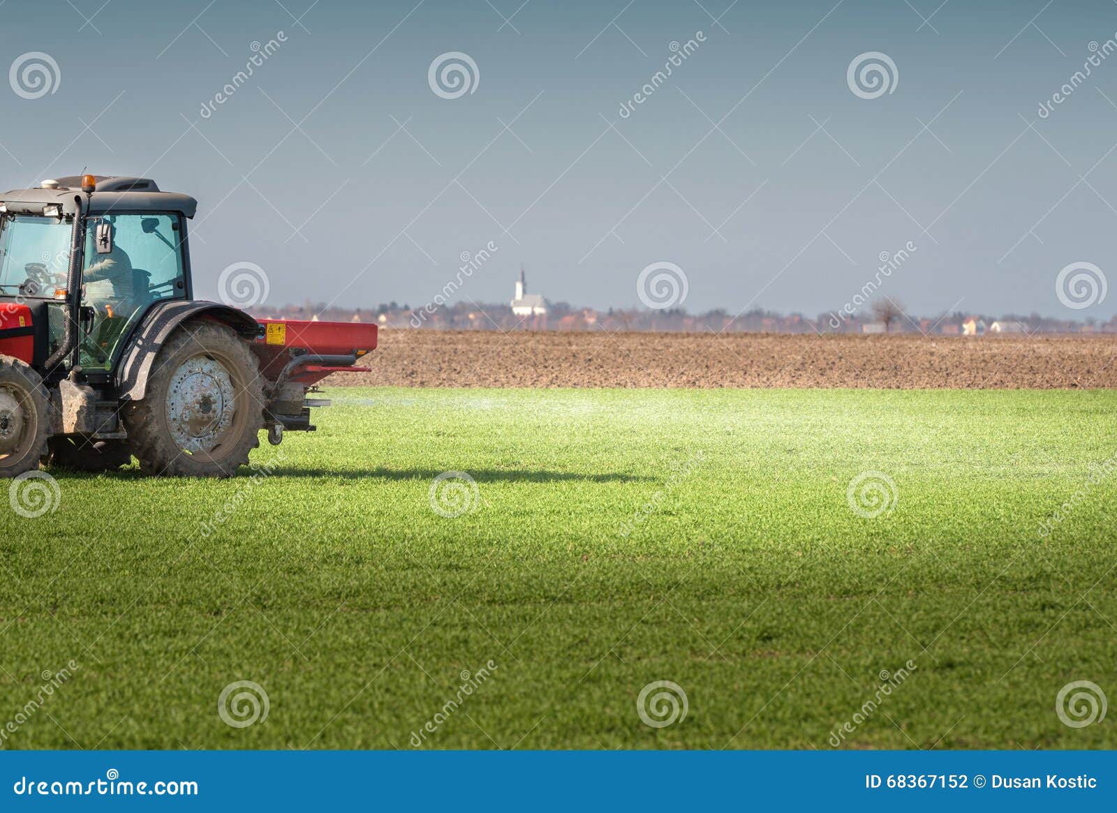Tractor Fertilizing in Field Stock Photo - Image of agriculture, scene ...