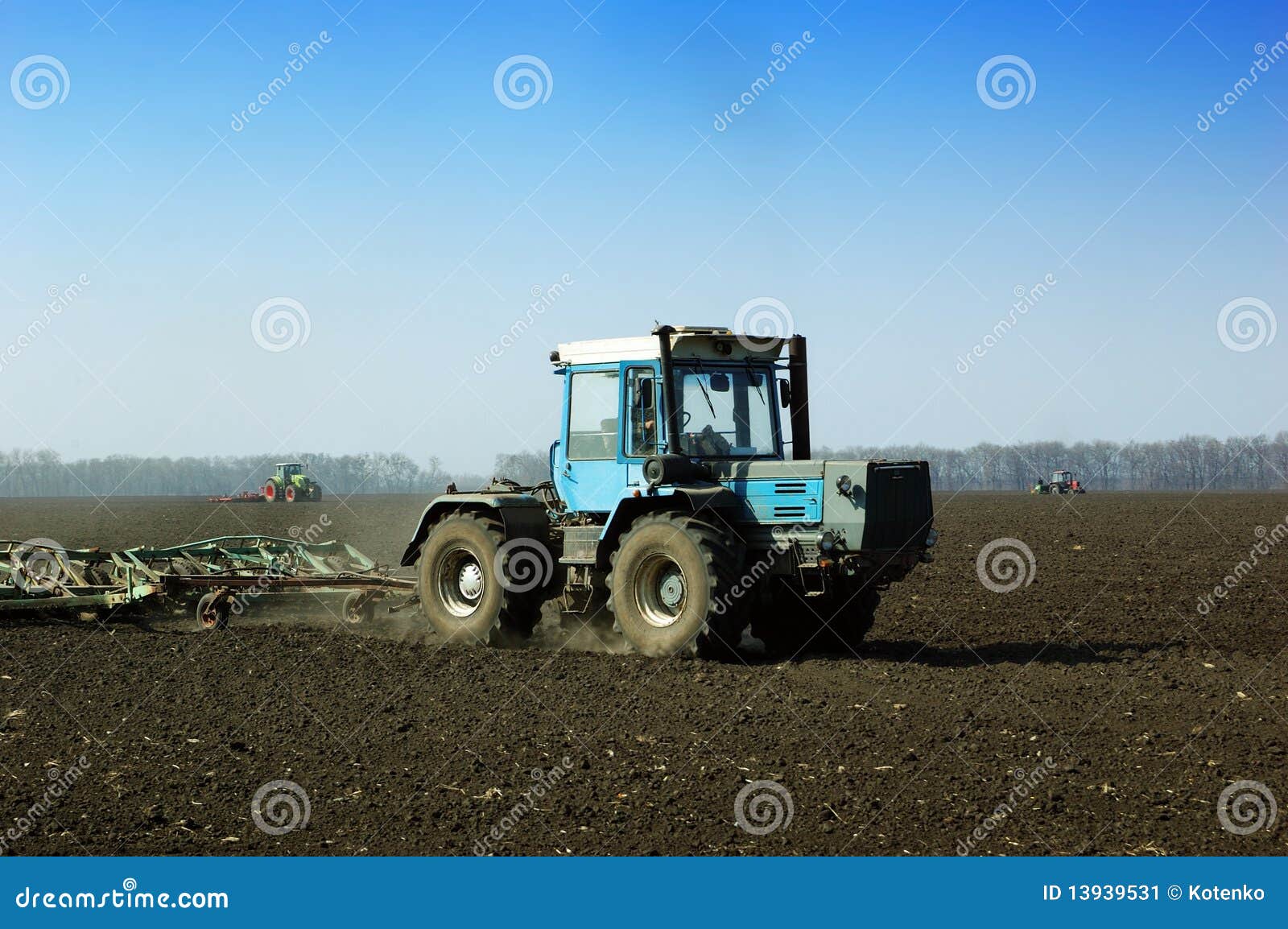 Tractor in the Field stock image. Image of blue, commodities - 13939531