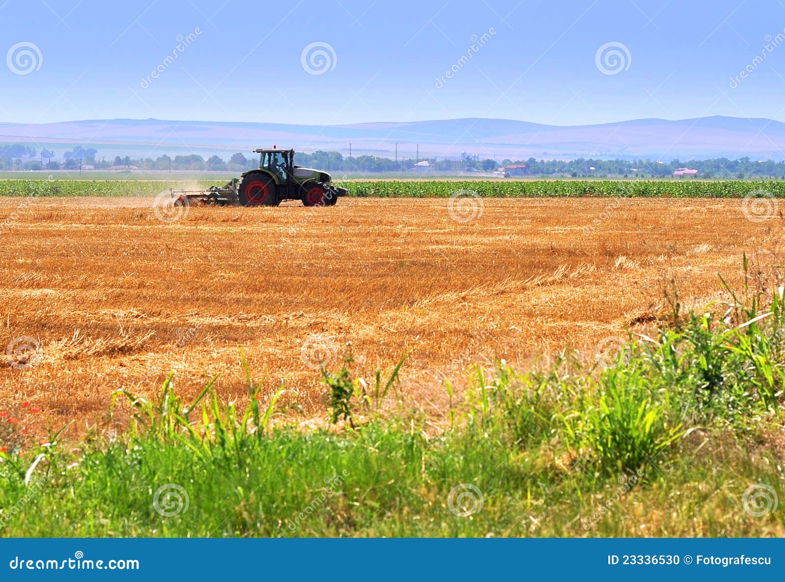 Tractor on a field stock photo. Image of industrial, commodity - 23336530