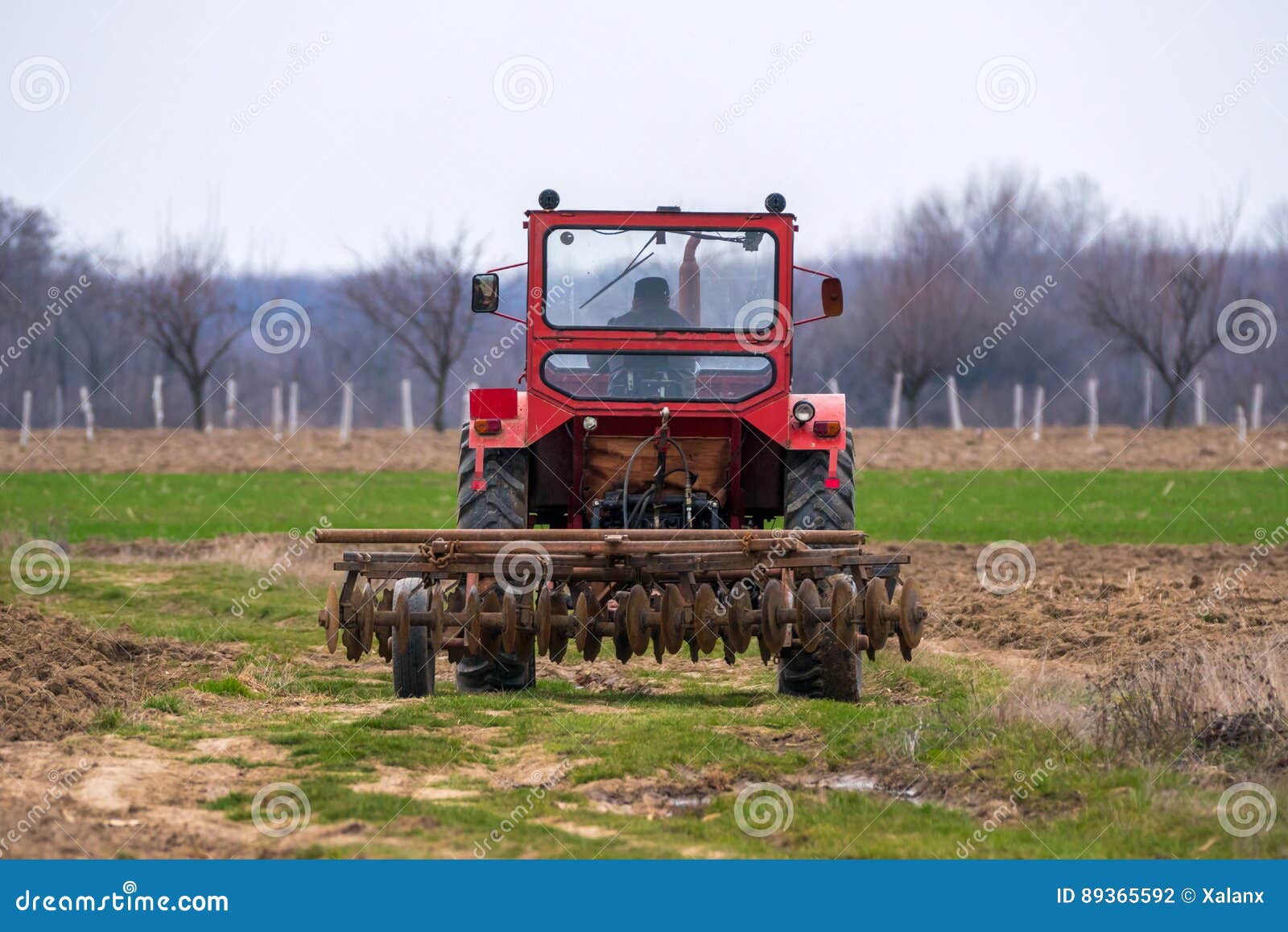 Tractor on a field stock photo. Image of growth, plough - 89365592