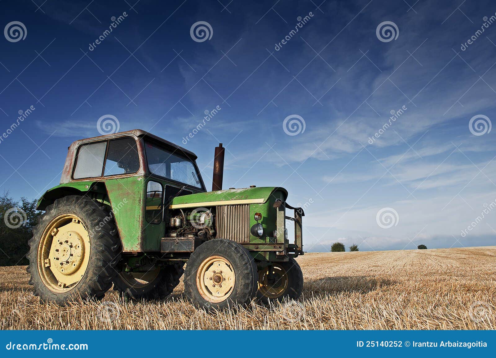 Tractor in a Field of Grain Stock Photo - Image of green, agriculture ...