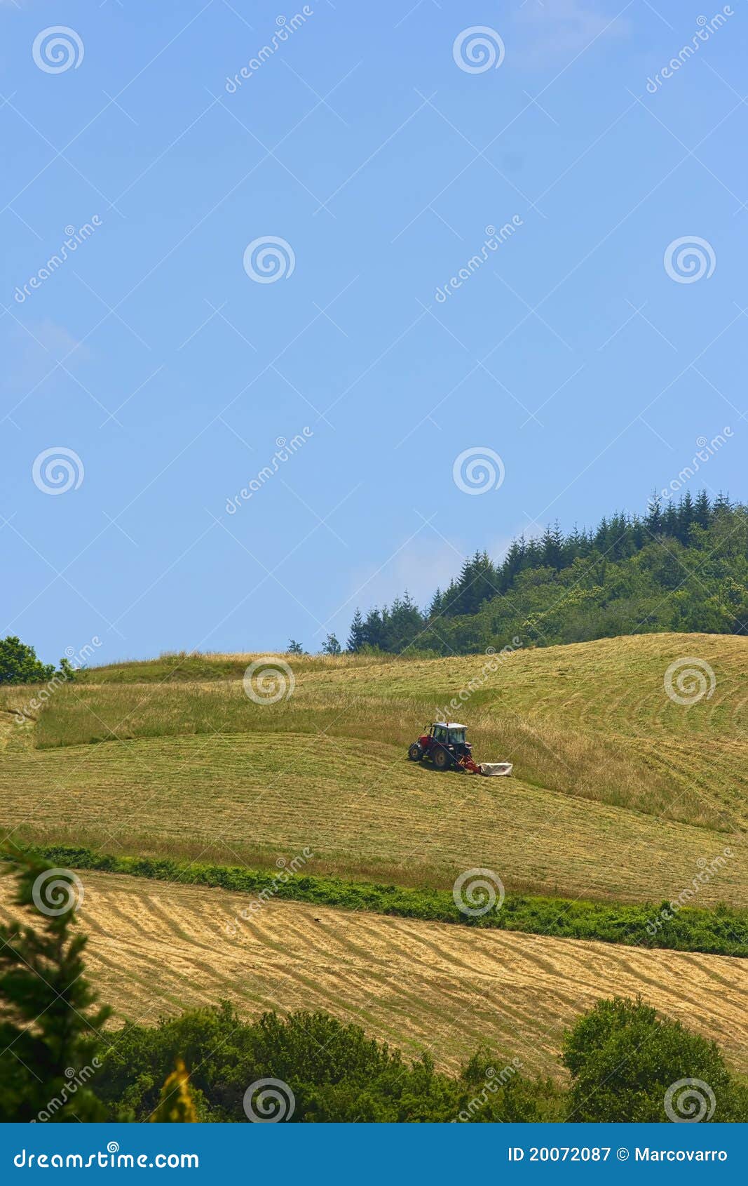 Tractor in a Field Over a Hill Stock Image - Image of agriculture, farm ...