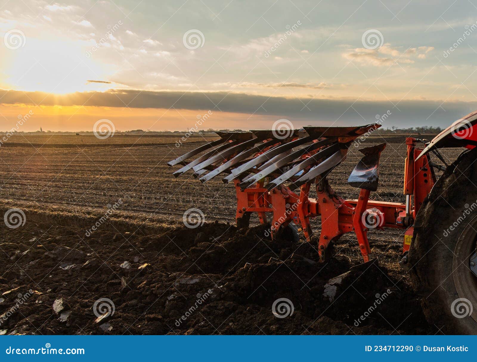 Tractor on the Field during Sunset Stock Photo - Image of machinery ...