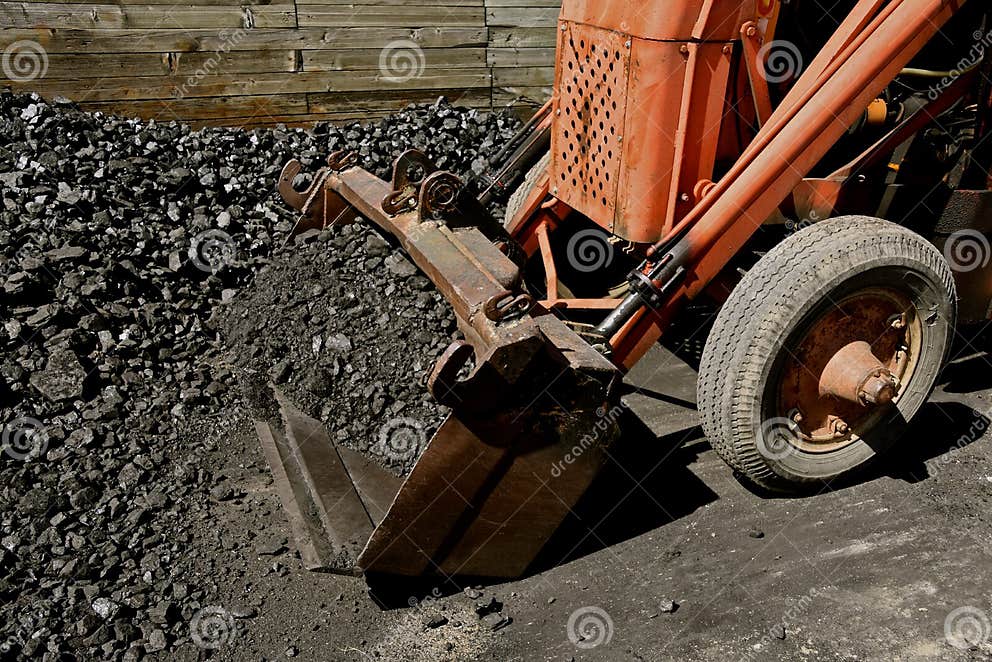 Tractor with a Front End Scoop is Loading Coal Stock Photo - Image of ...