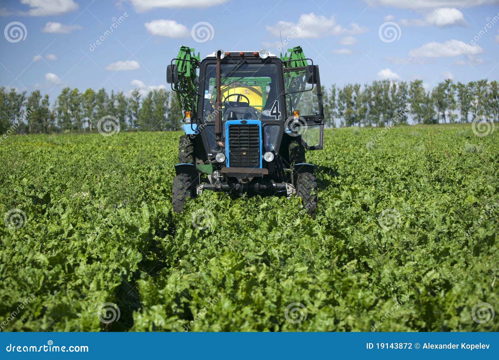 Tractor in green field stock photo. Image of machine - 19143872