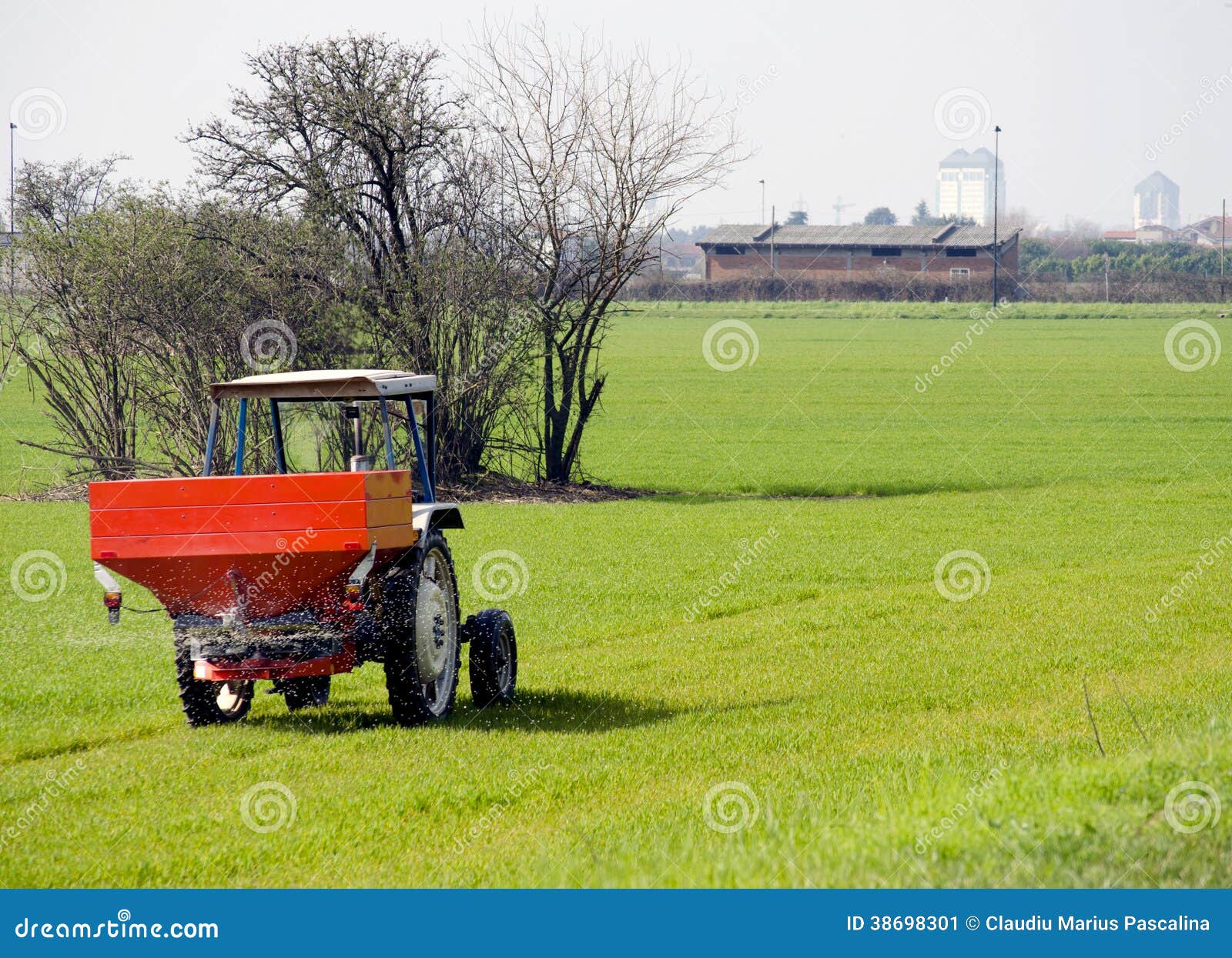 Tractor in a green field stock image. Image of scene - 38698301
