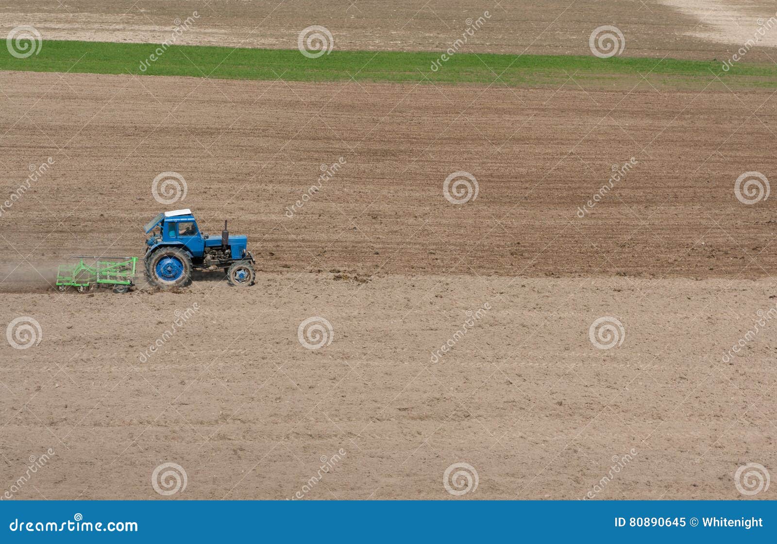 Tractor Harrowed Field stock image. Image of spring, tillage - 80890645