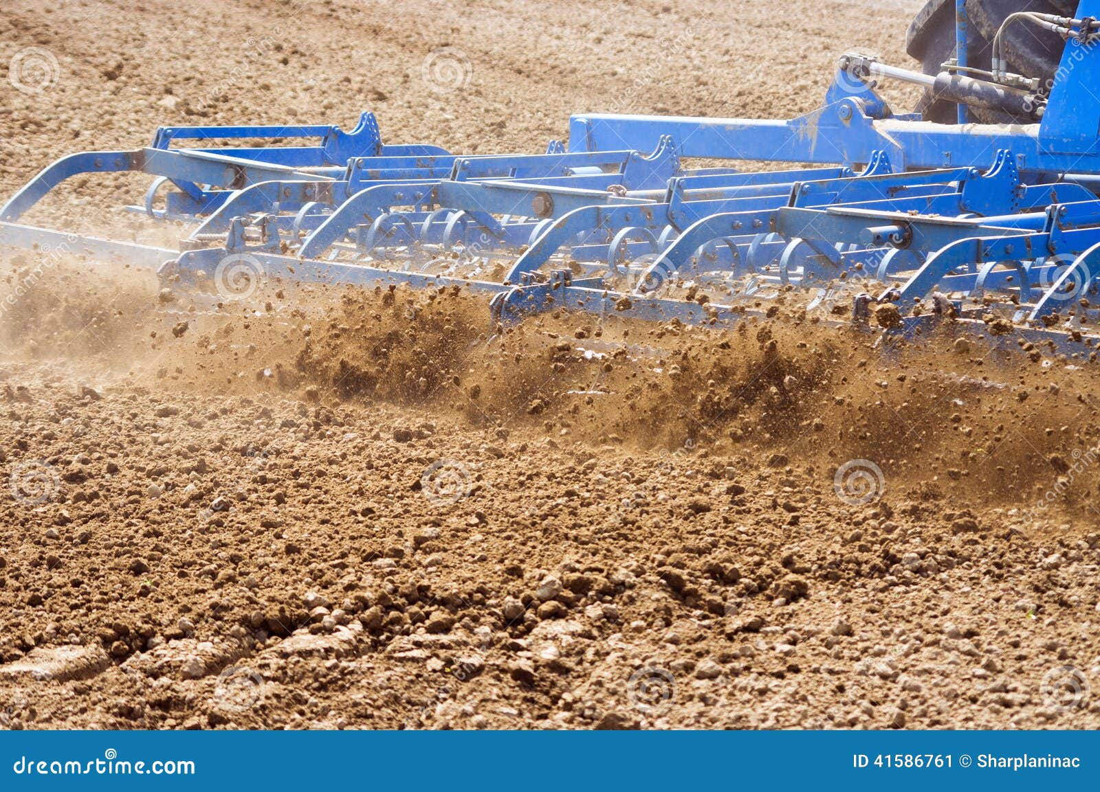 Tractor harrowing closeup stock image. Image of harrow - 41586761