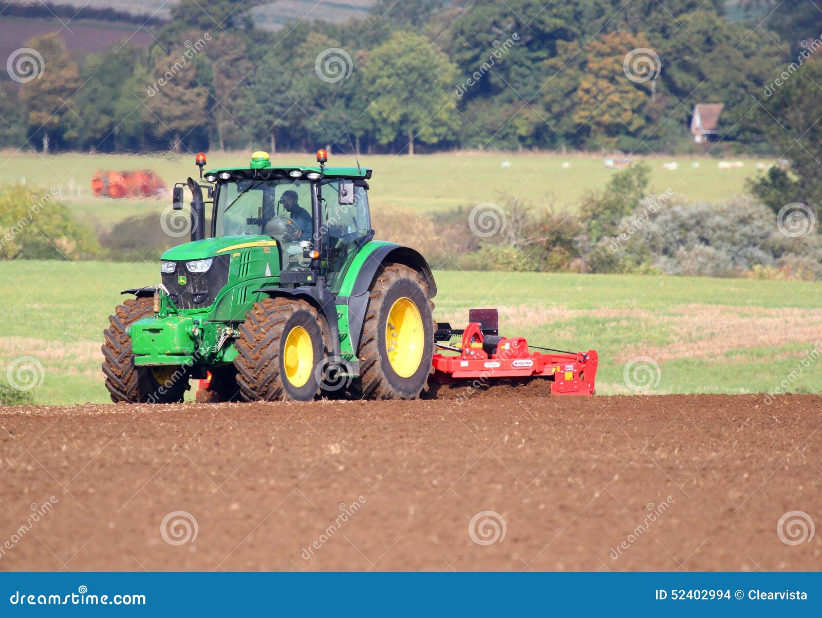 Tractor harrowing field. editorial stock image. Image of soil - 52402994