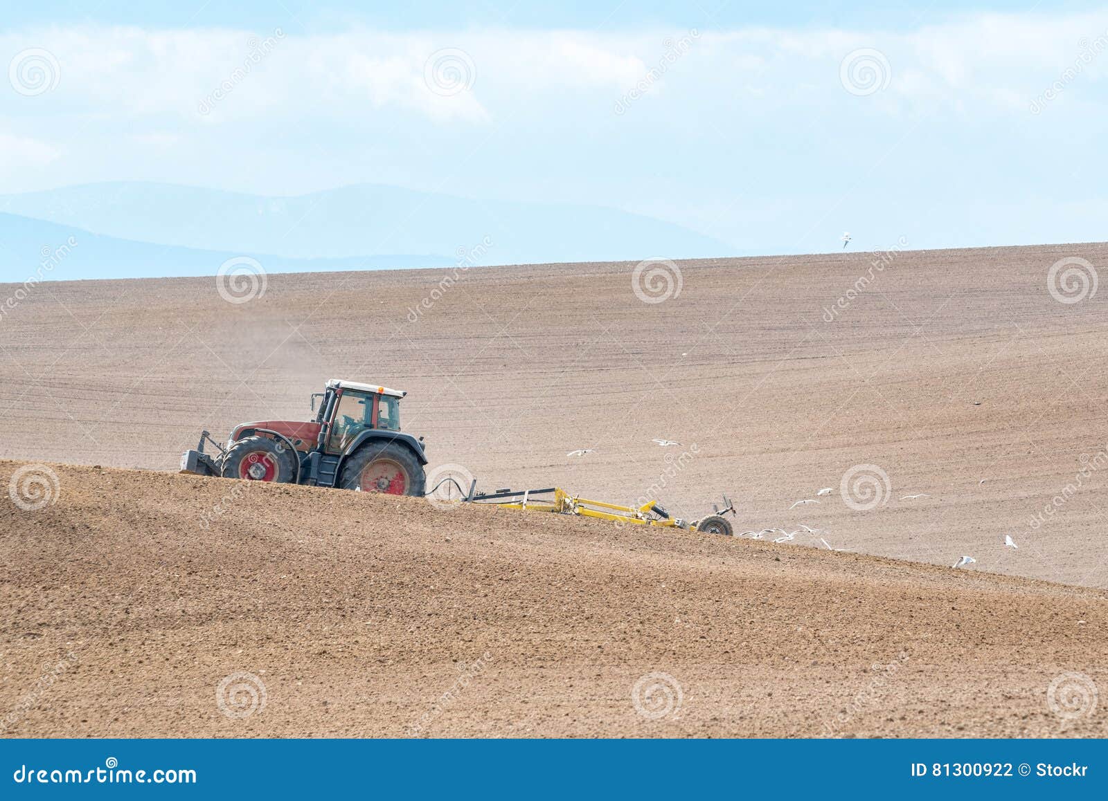Tractor Harrowing the Field Stock Photo - Image of drive, cultivator ...