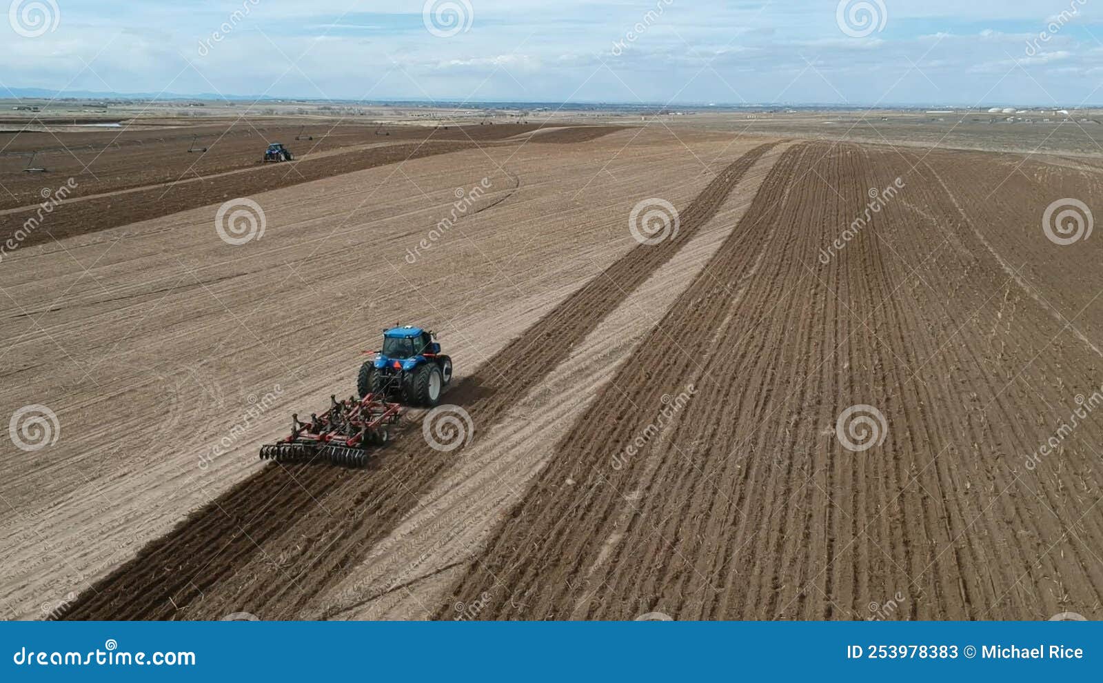 Tractor harrowing field stock video. Video of parallel - 253978383