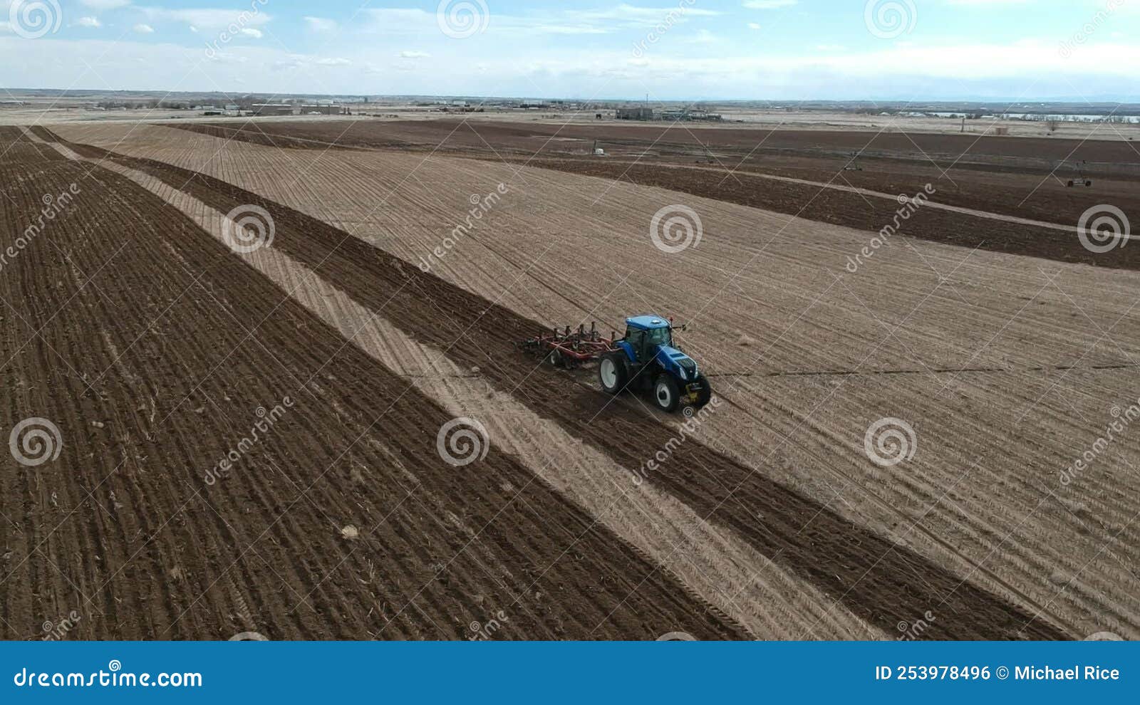 Tractor harrowing field stock footage. Video of agricultural - 253978496