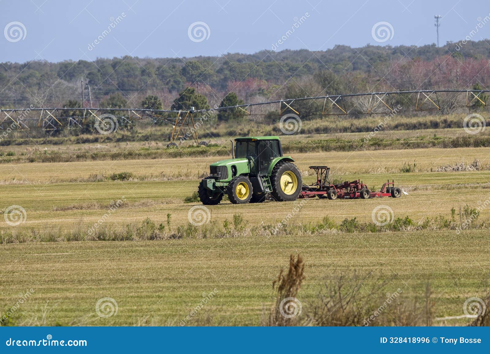 Tractor Harvesting Crops in a Field Stock Photo - Image of agriculture ...