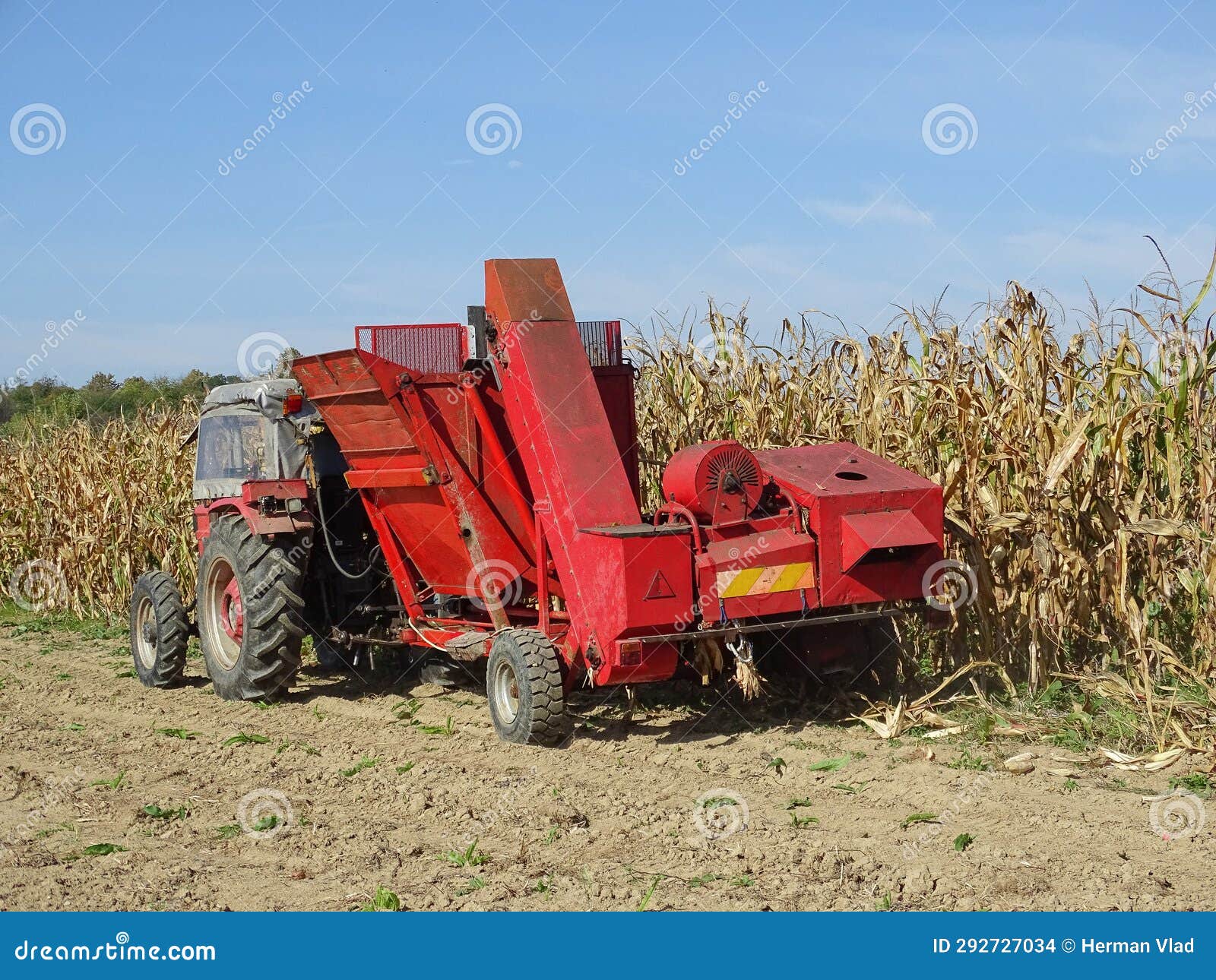 A Tractor Harvests Corn from the Field. in Maramures County, Romania ...