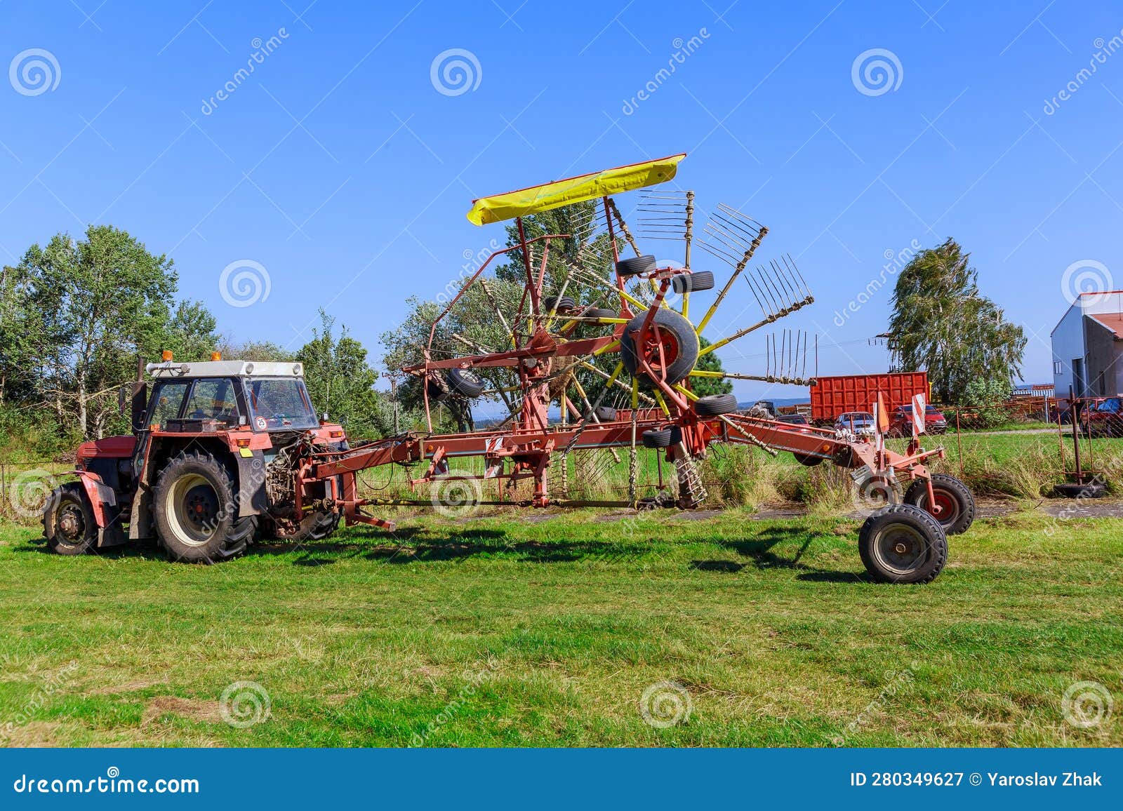 Tractor with Hay Rake Attached. with Help of Tractor, Farmer Compressed ...