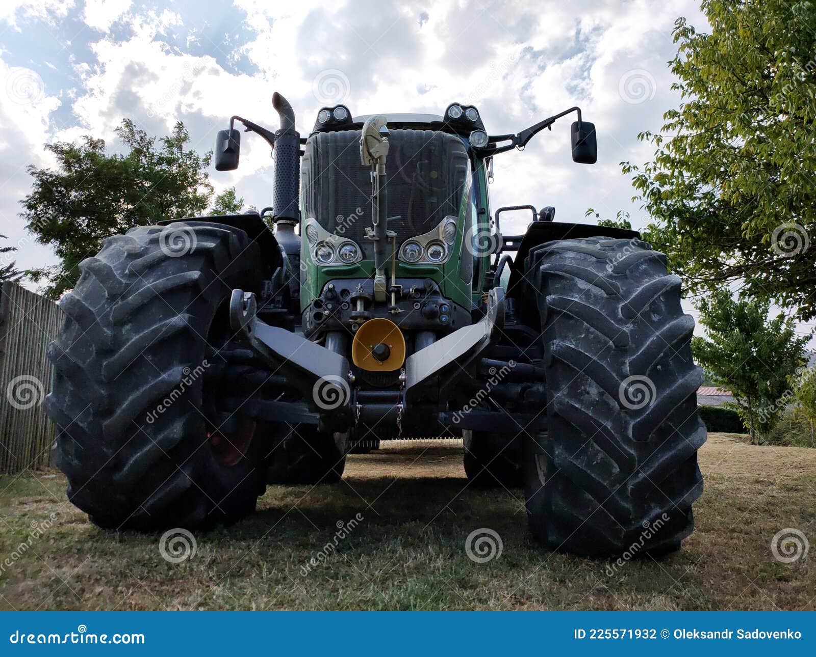 Tractor with Huge Wheels Against the Sky Stock Photo - Image of machine ...