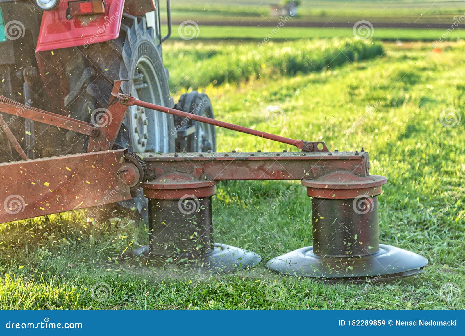 A Tractor with Implements Mower Cuts Clover. Tractor Mowing Paddock ...