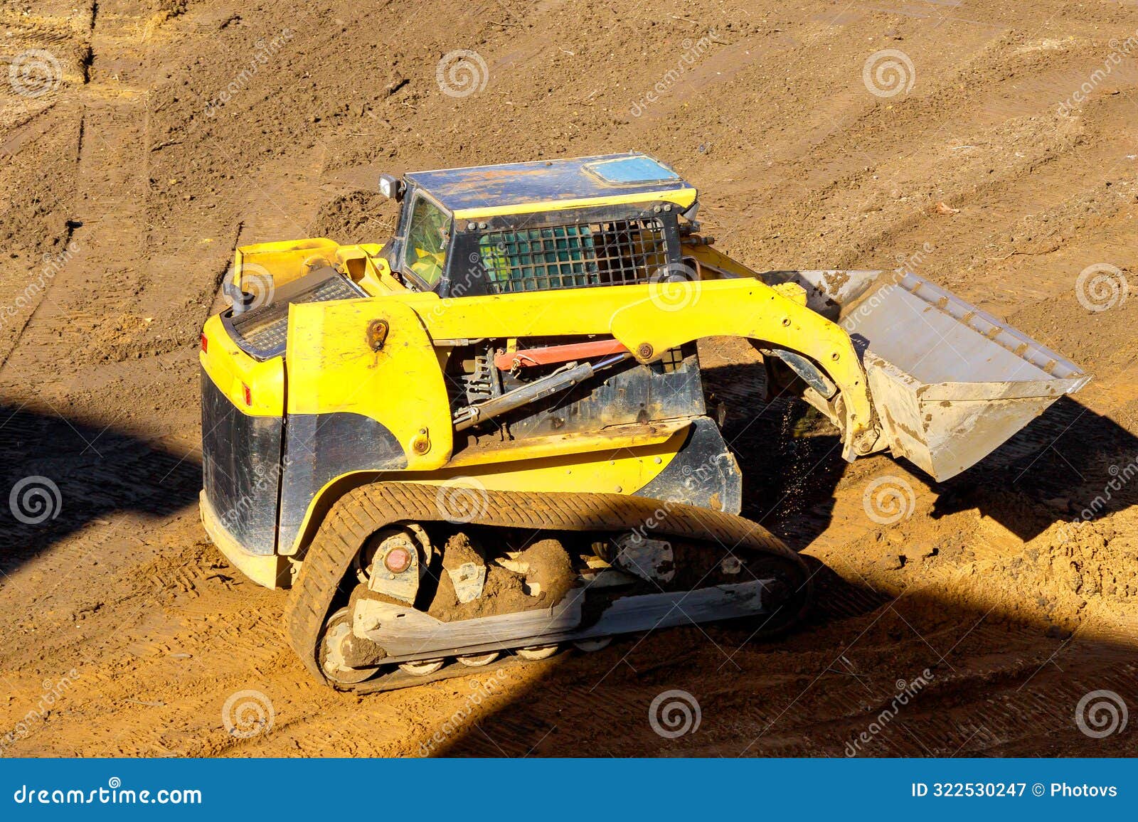 This Tractor is Leveling Ground As Part of a Construction Project in ...