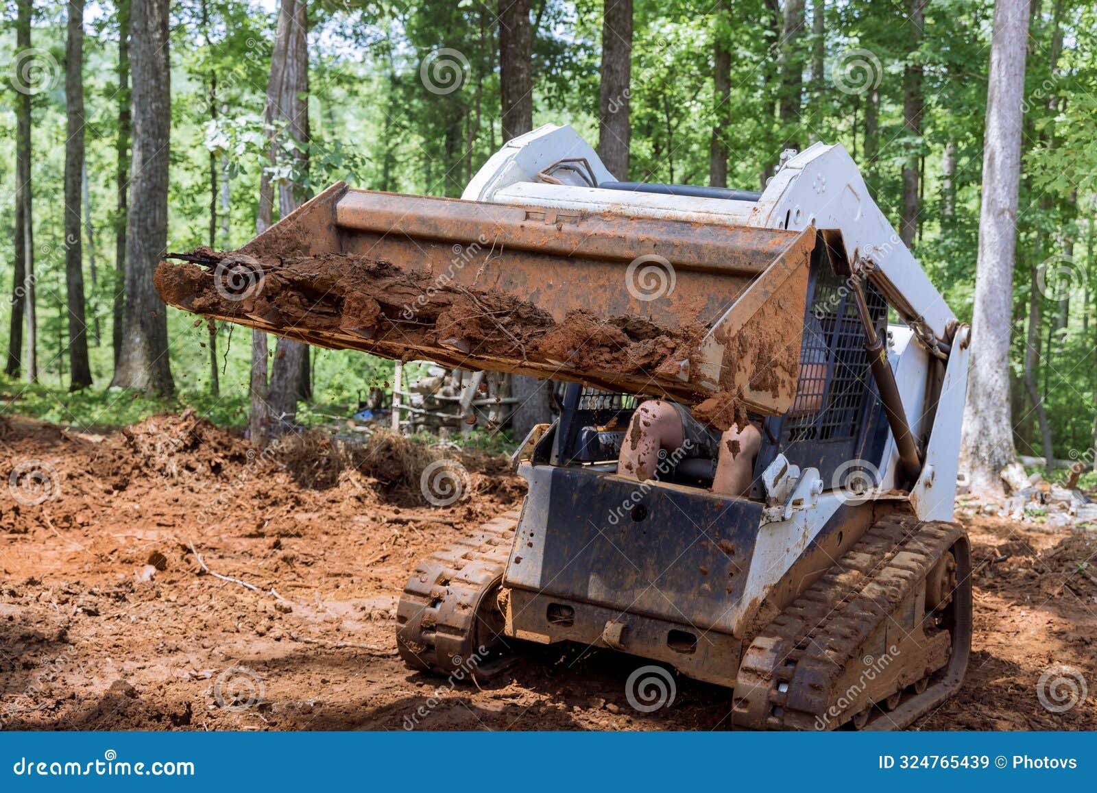 Tractor is Leveling Ground at a Earthmoving in Cleaning Backyard ...