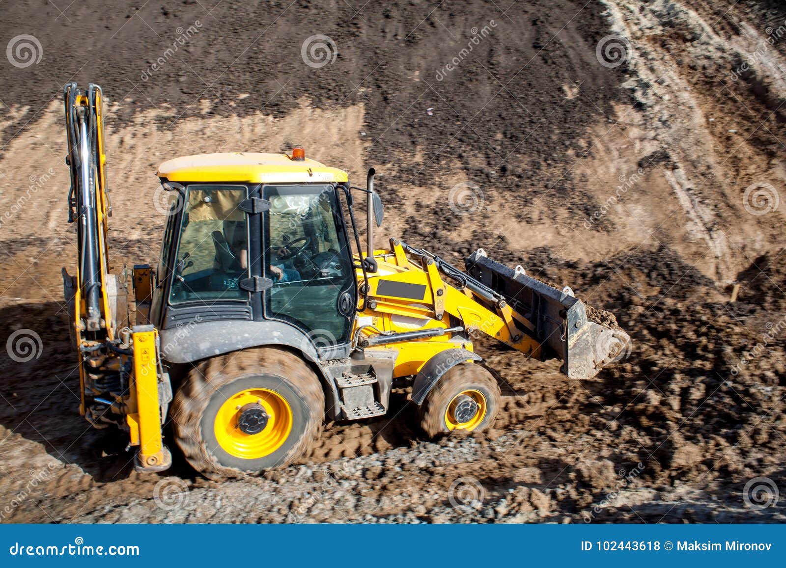 Tractor Loader Backhoe Digger Loader on a Construction Site with Blue ...
