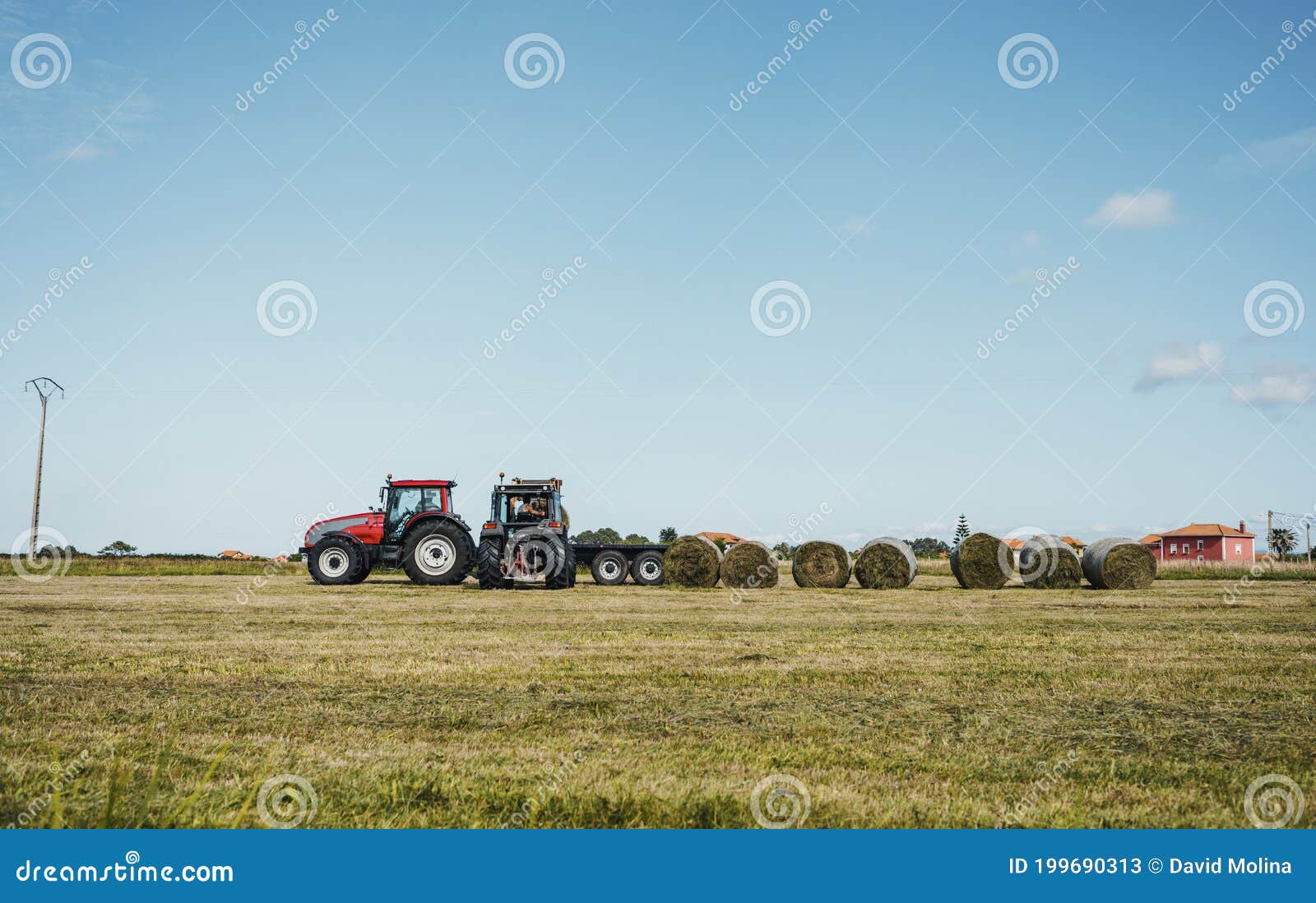 A Tractor Loading a Trailer during Harvesting Time Stock Image - Image ...