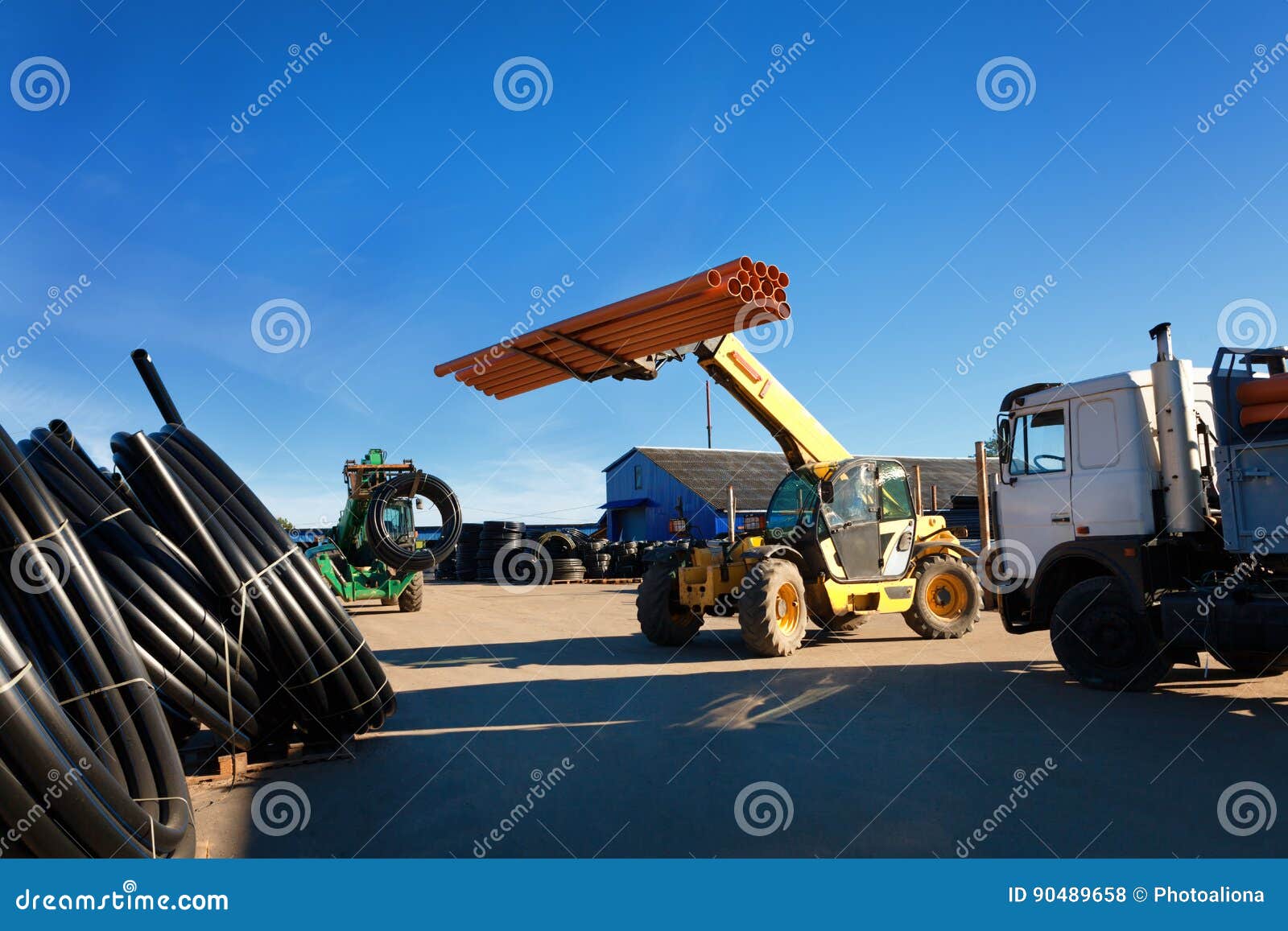 Tractor Loads Stacks of Black Pvc Plastic Pipe Outdoors Outside the ...