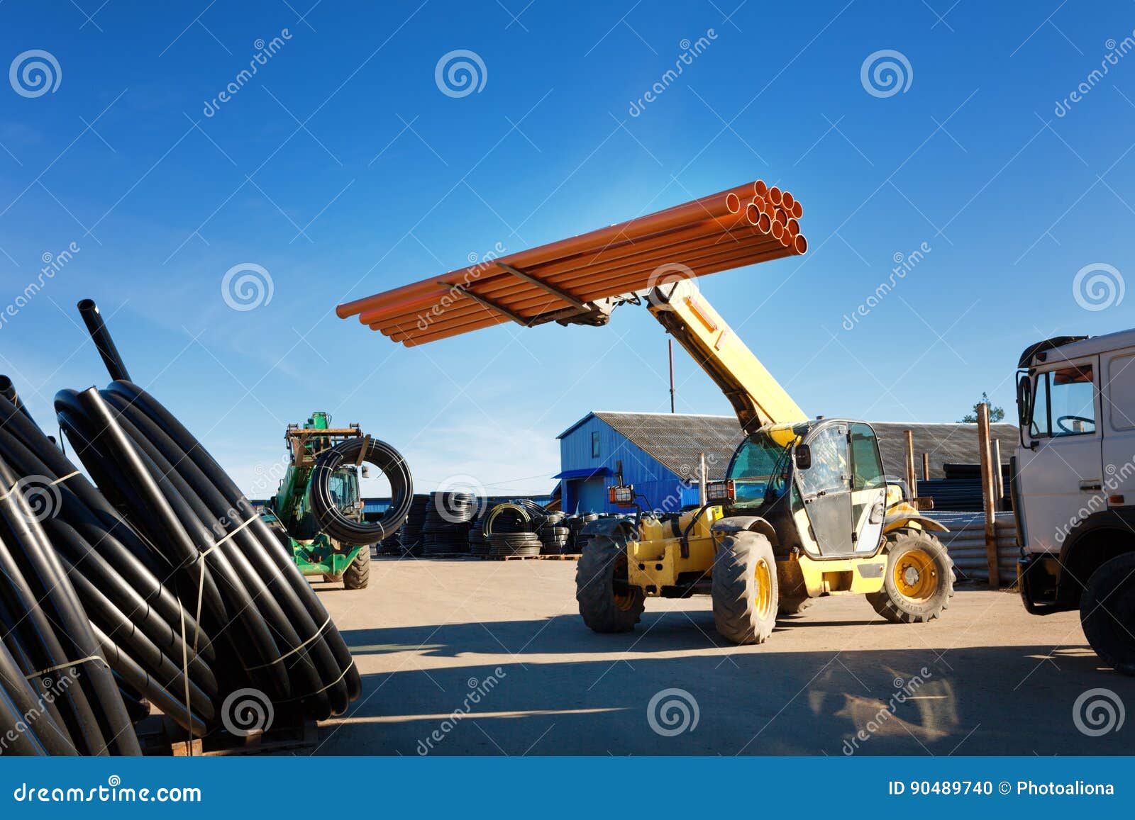 Tractor Loads Stacks of Black Pvc Plastic Pipe Outdoors Outside the ...