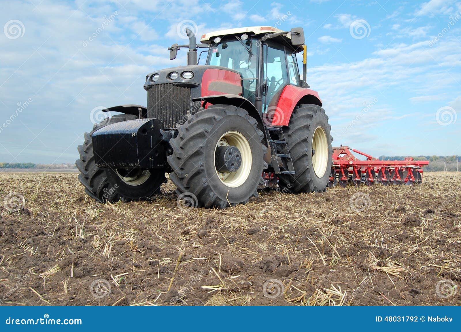 Tractor makes tillage stock photo. Image of agriculture - 48031792