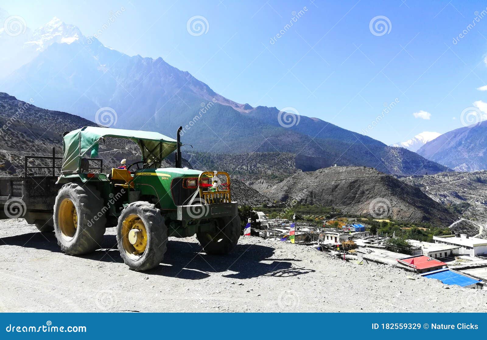 Tractor in the Mountains,Amazing View of the Tractor Editorial Stock ...