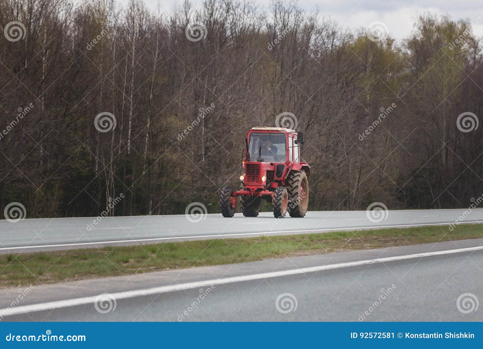 Tractor moving on highway stock image. Image of tractor - 92572581