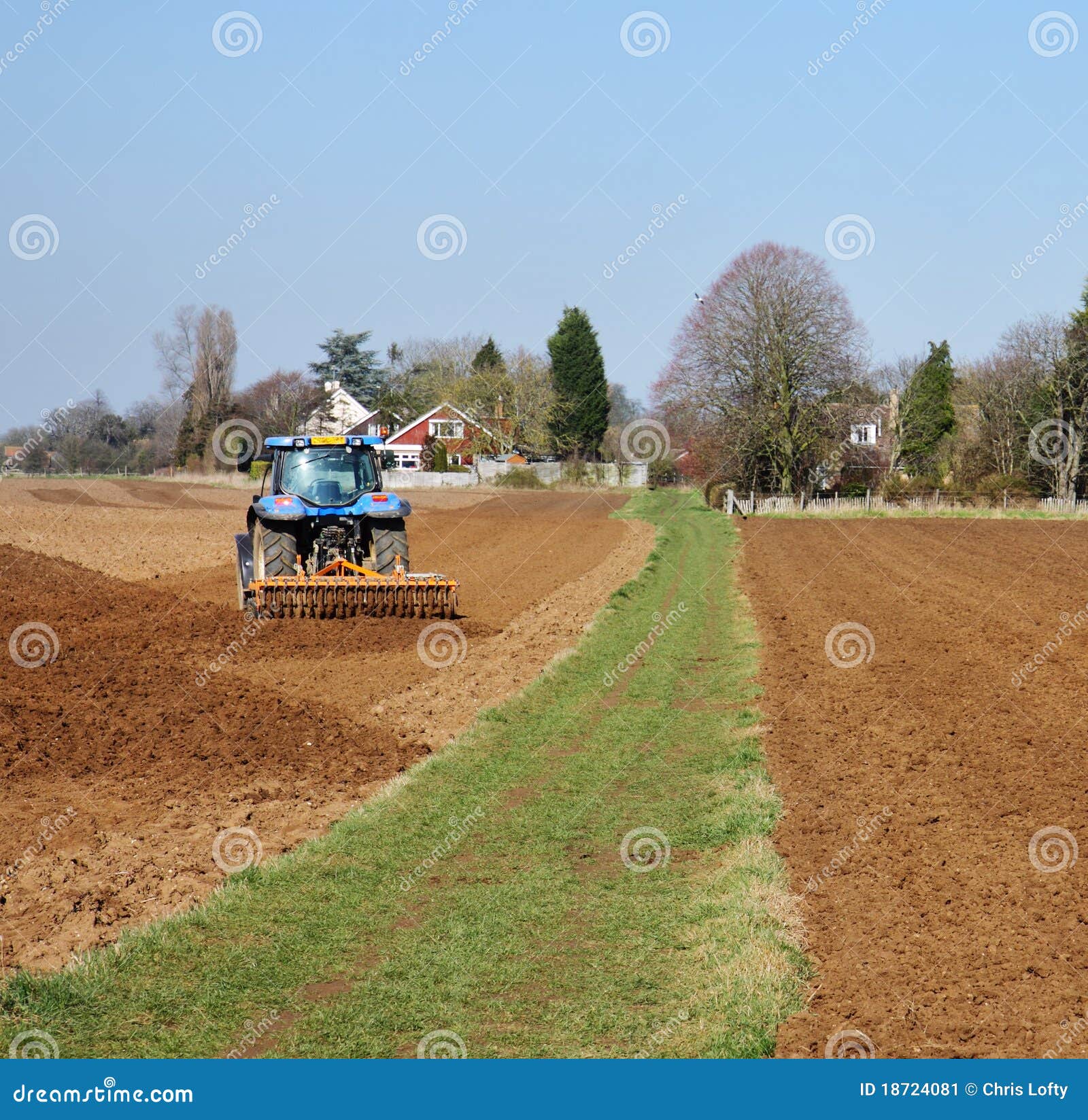 Tractor Ploughing a field stock image. Image of vehicles - 18724081