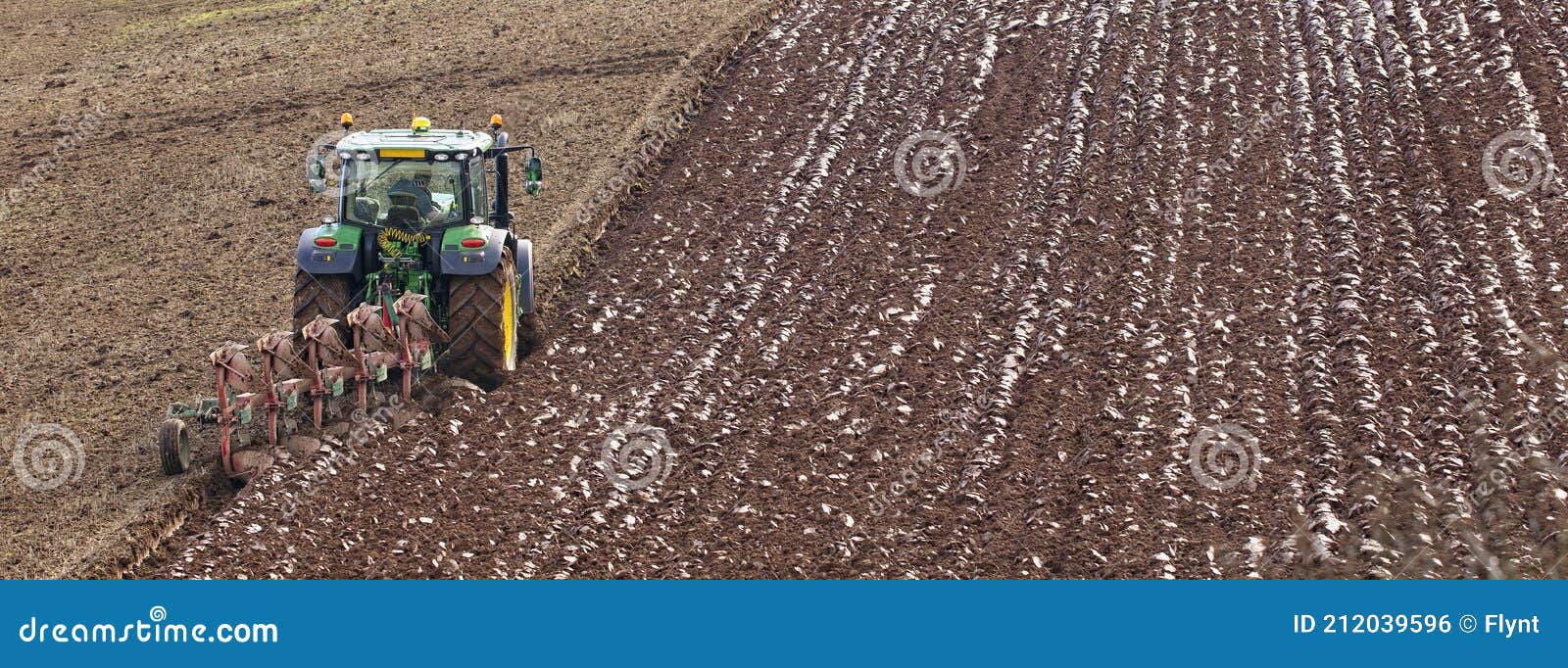 Tractor Ploughing Field and Cultivating Land in Springtime Stock Photo ...