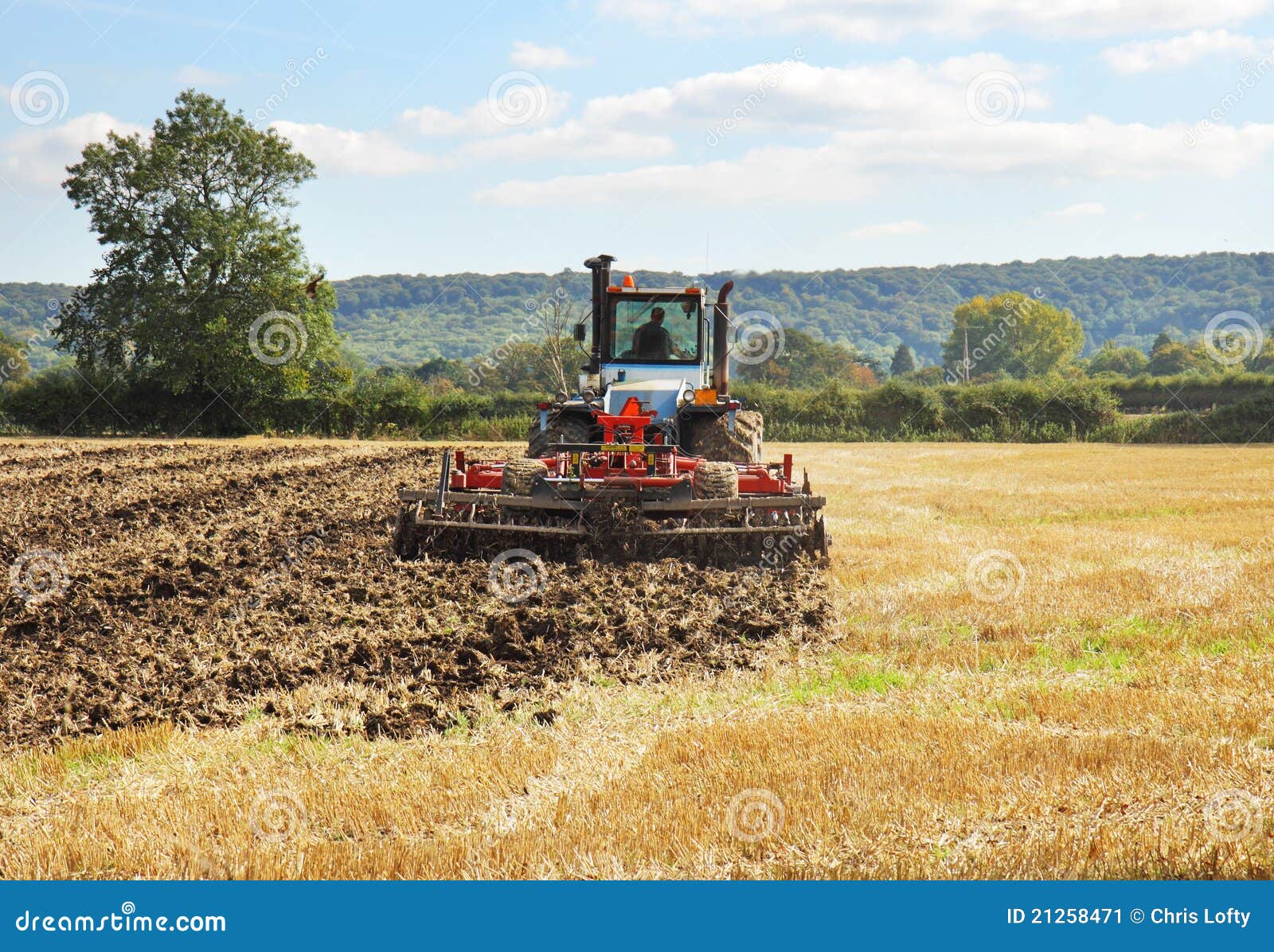 Tractor Ploughing Over a Field of Wheat Stubble Stock Image - Image of ...