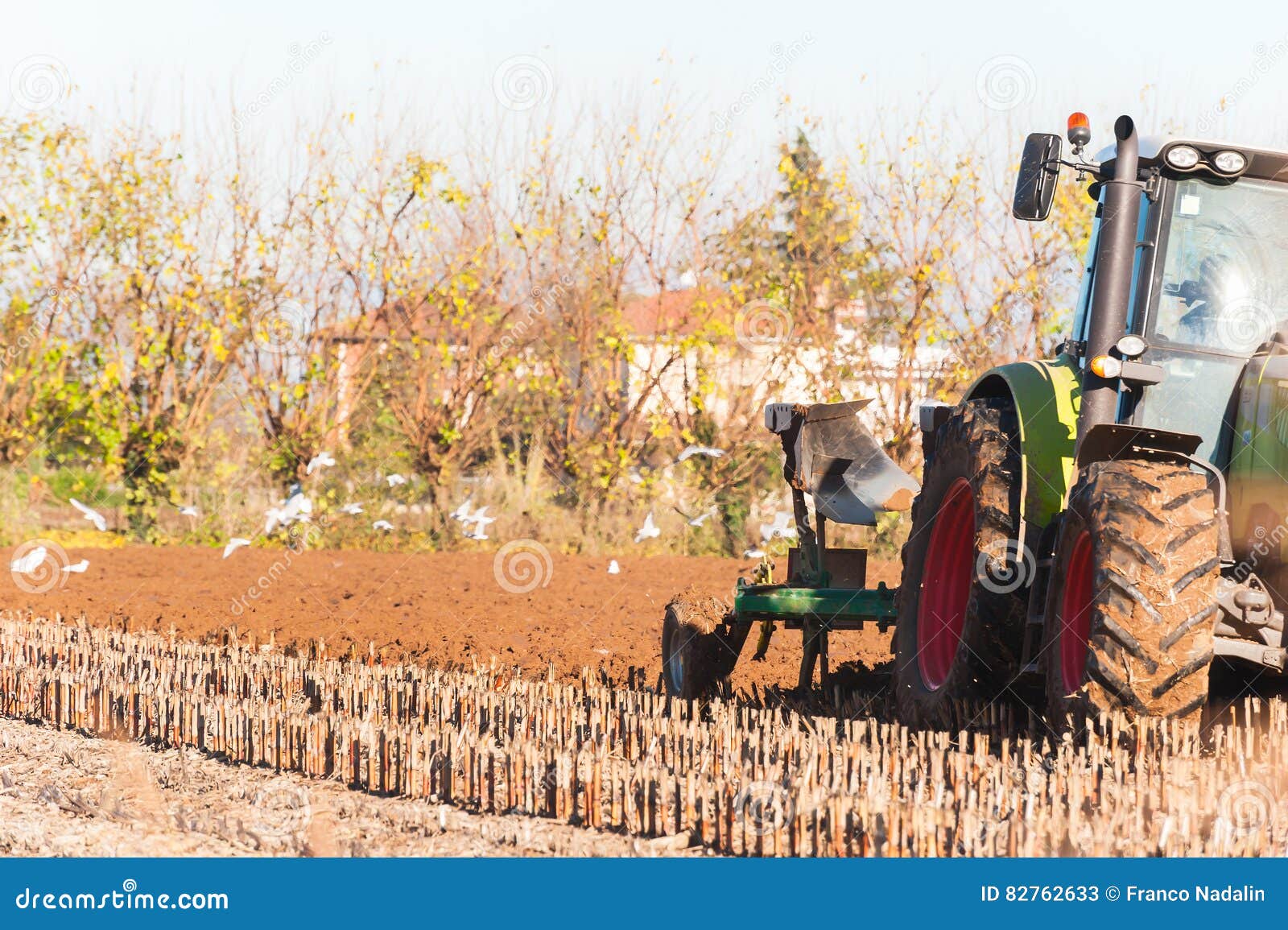 Tractor with Plow. Plowing a Field of Corn. Stock Image - Image of ...