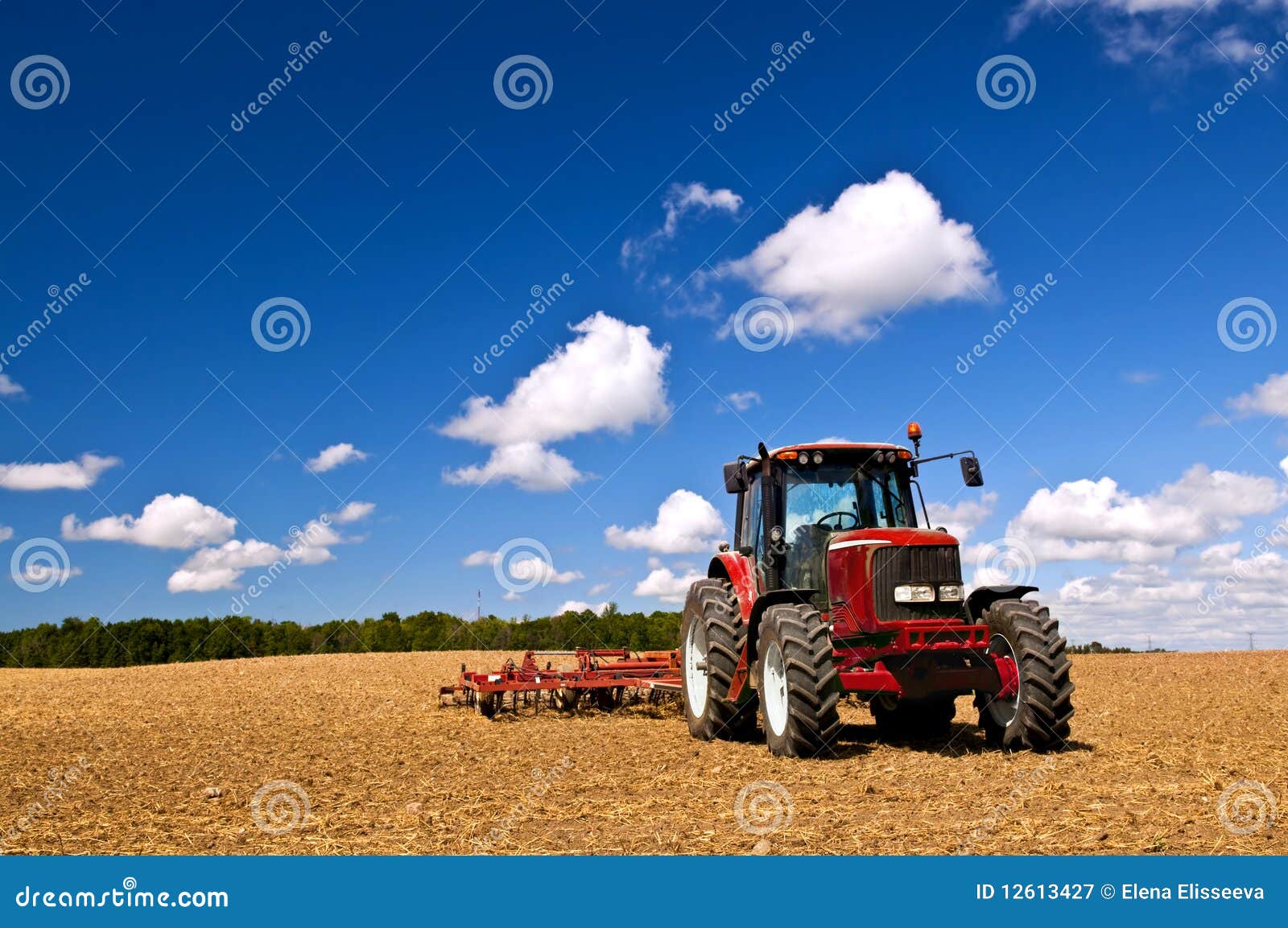Tractor in plowed field stock image. Image of bright - 12613427