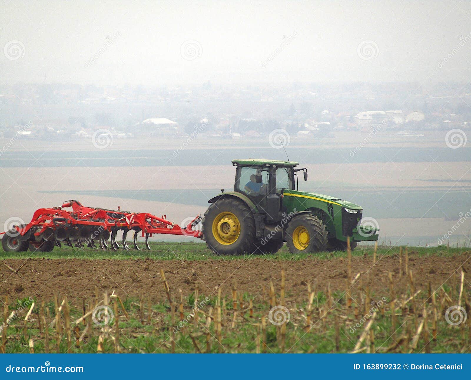 Tractor Plowing on the Field Editorial Photography - Image of machinery ...
