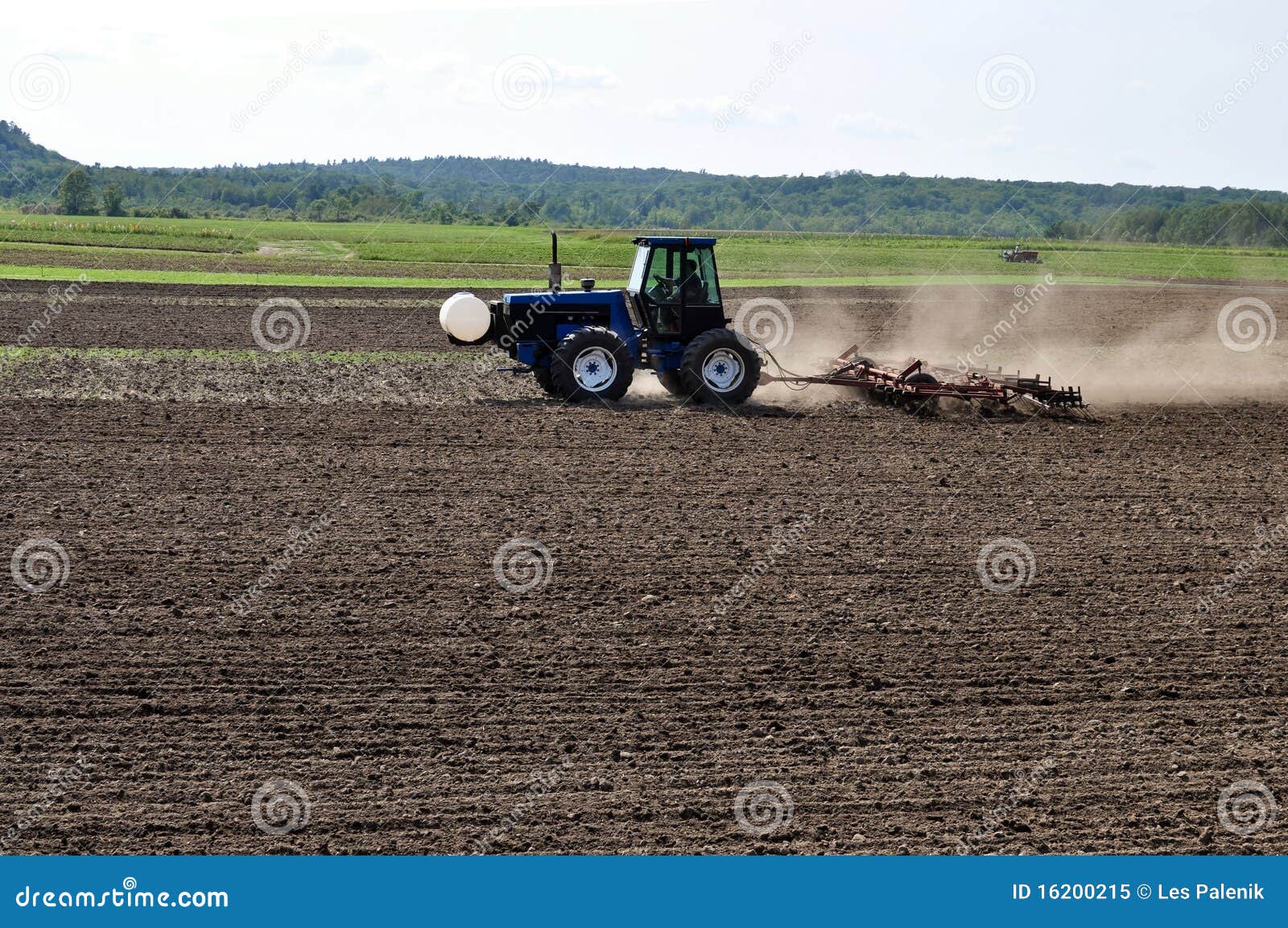Tractor plowing a field stock image. Image of agriculture - 16200215