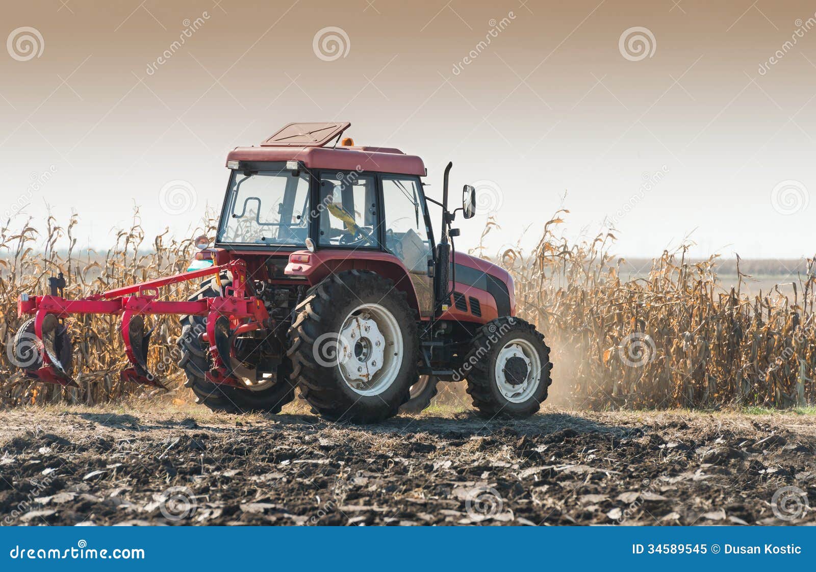 Tractor plowing field stock image. Image of agriculture - 34589545