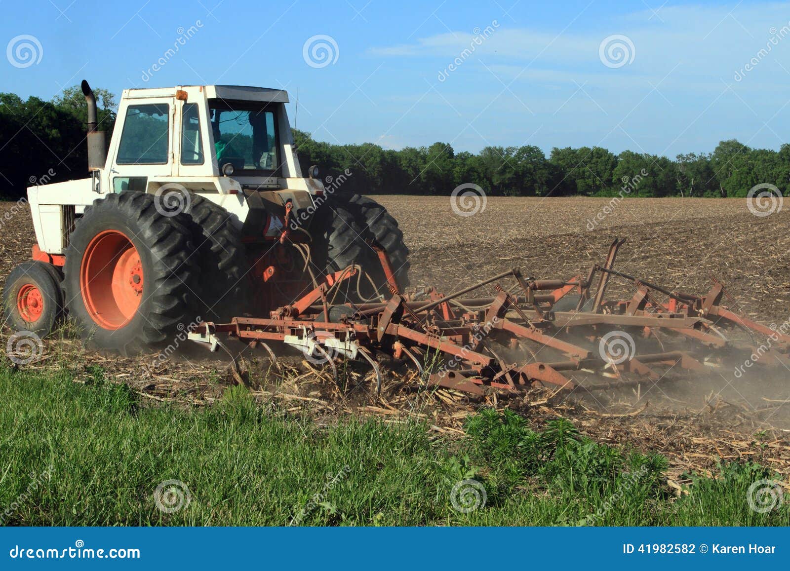 Tractor Plowing the Field stock photo. Image of plowing - 41982582