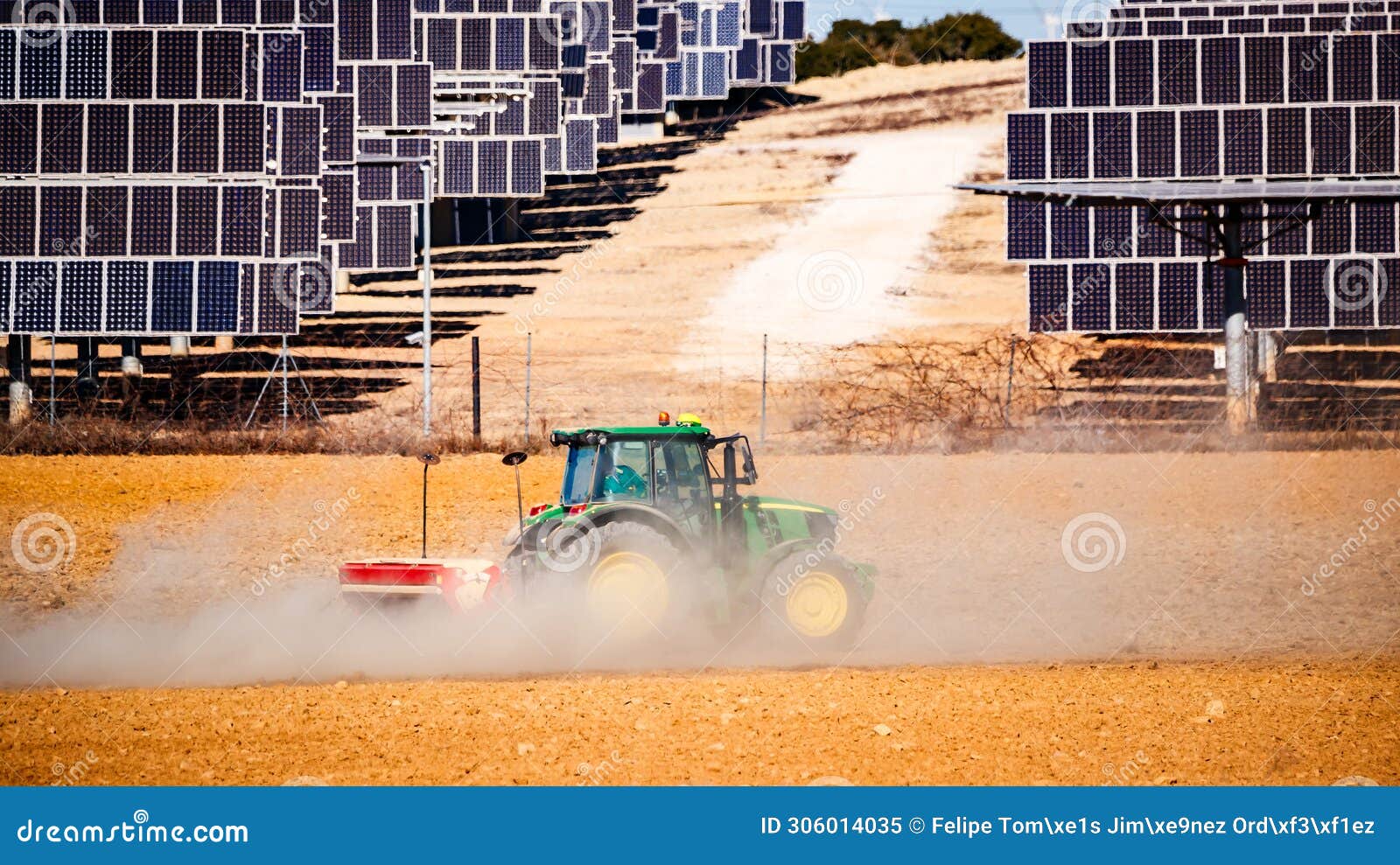 Tractor Plowing a Field Next To a Solar Panel Park in El Bonete Stock ...
