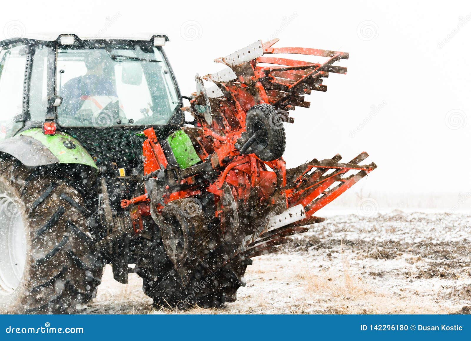Tractor plowing a field stock photo. Image of preparation - 142296180