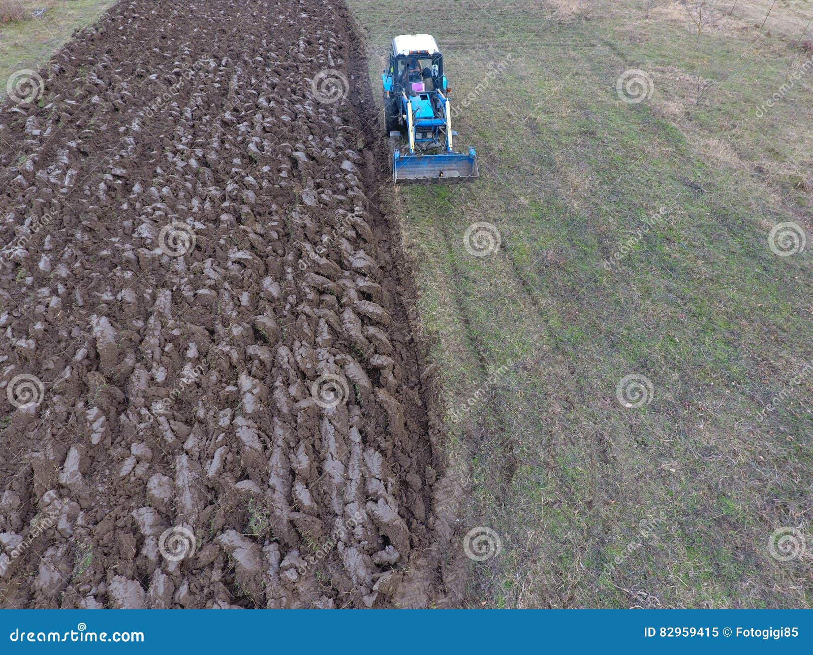 Tractor Plowing the Garden. Plowing the Soil in the Garden Stock Image ...