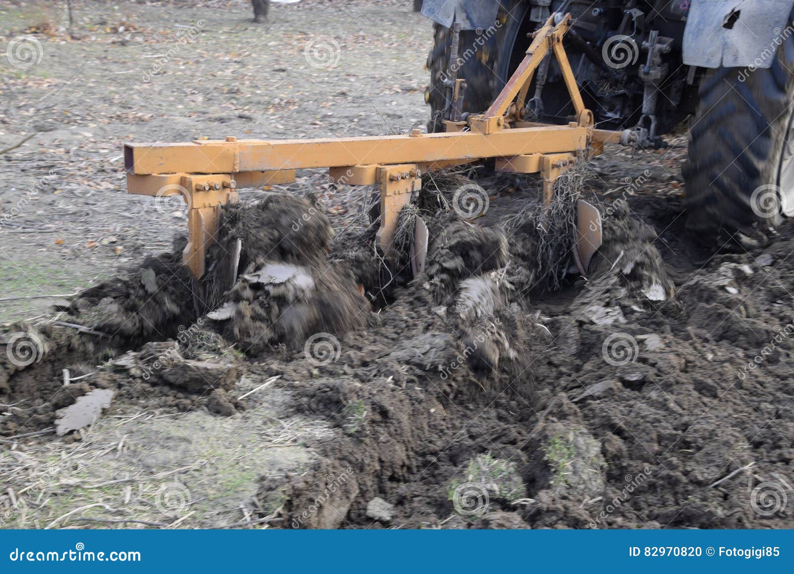 Tractor Plowing the Garden. Plowing the Soil in the Garden Stock Photo ...