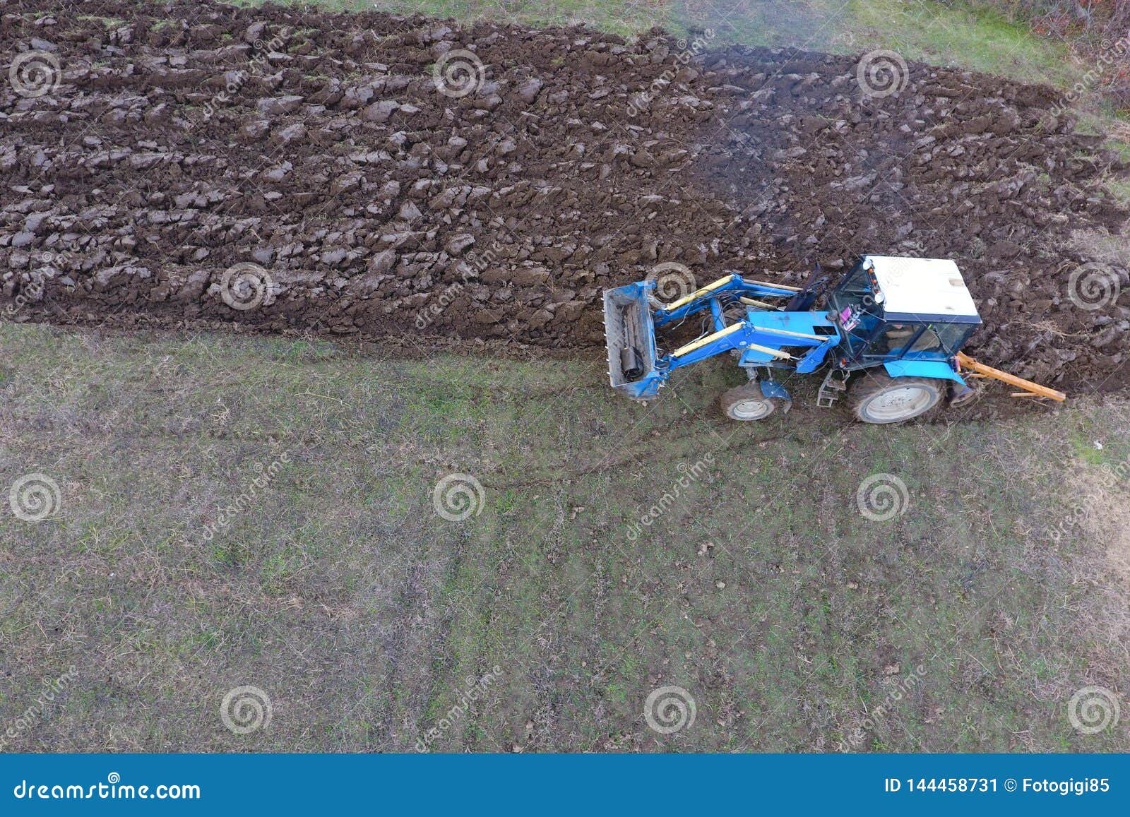 Tractor Plowing the Garden. Plowing the Soil in Stock Image - Image of ...
