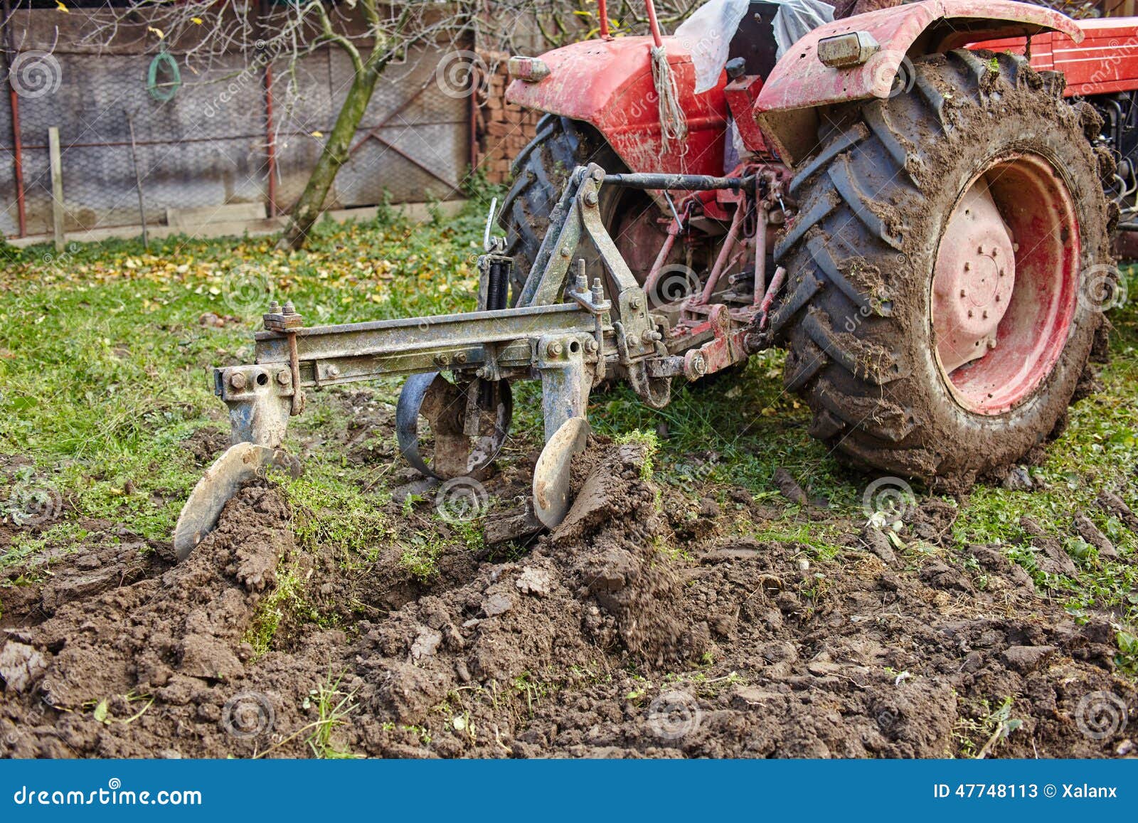 Tractor plowing the land stock image. Image of farmer - 47748113